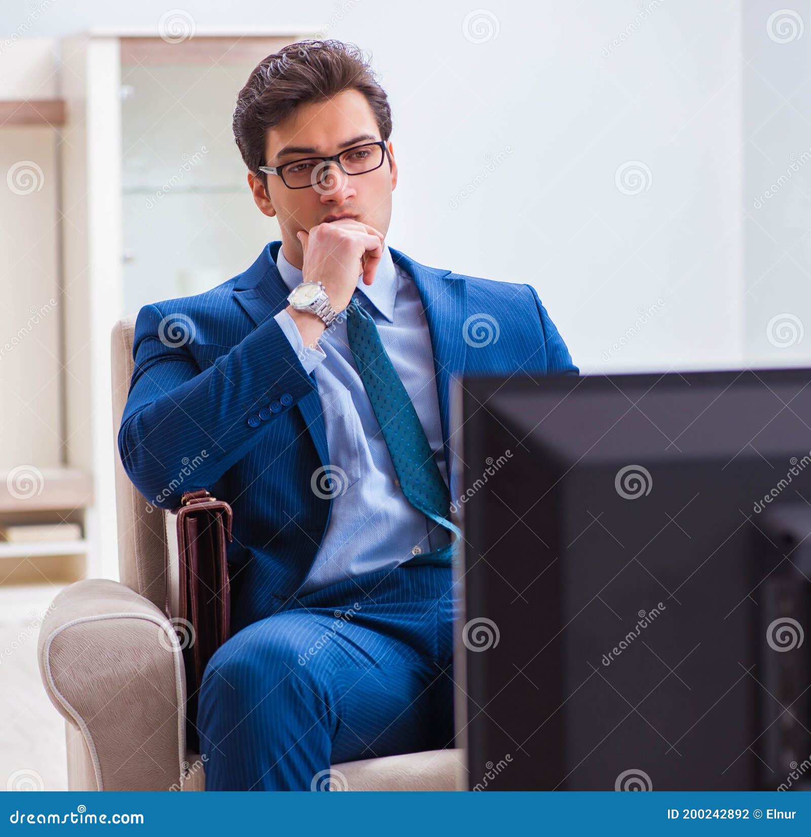 Businesman Watching Tv in Office Stock Photo - Image of multimedia ...