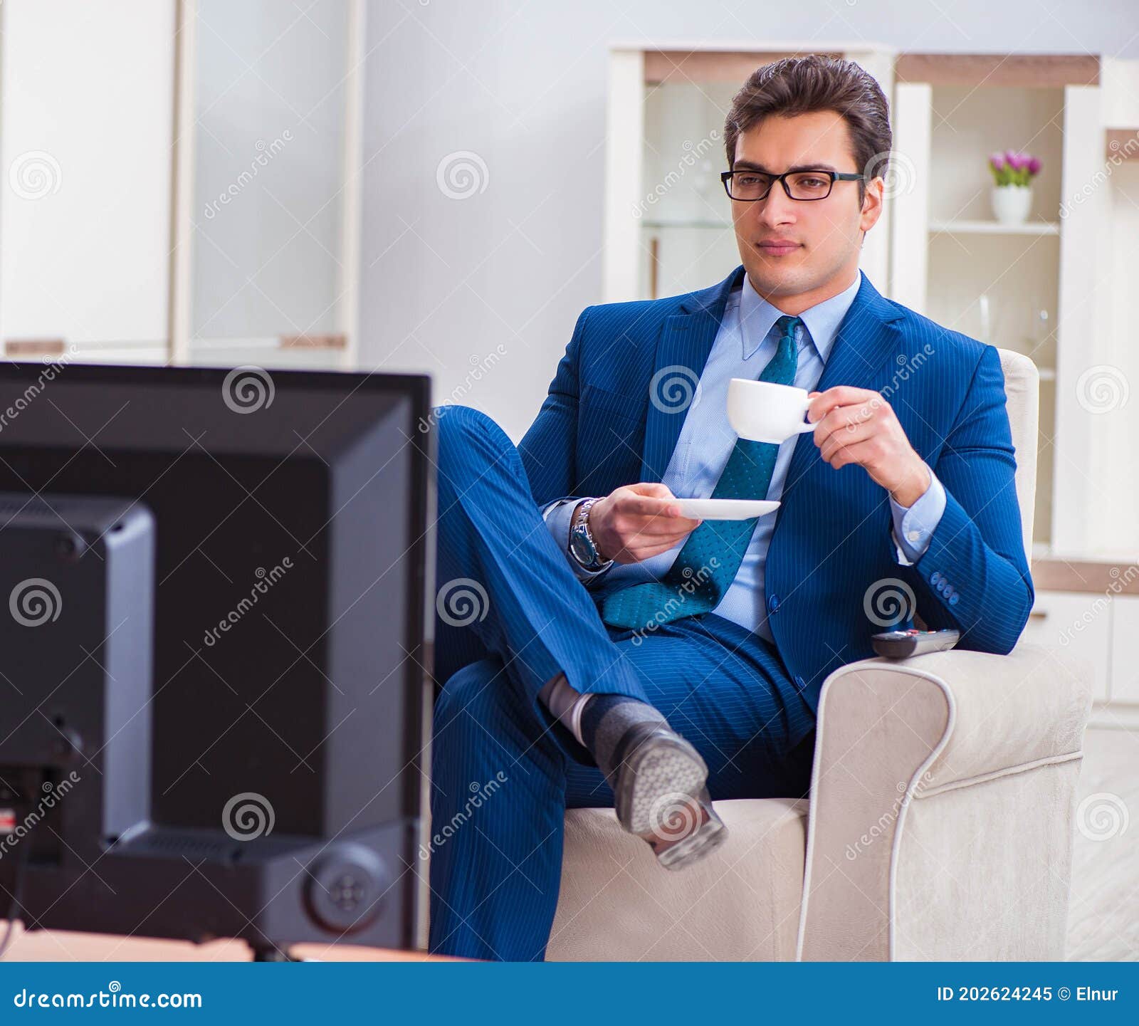 Businesman Watching Tv in Office Stock Image - Image of relaxation ...