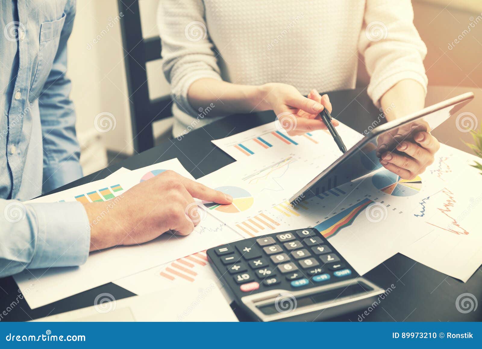 Business Analysis - People Discussing Financial Graphs at Office Stock ...