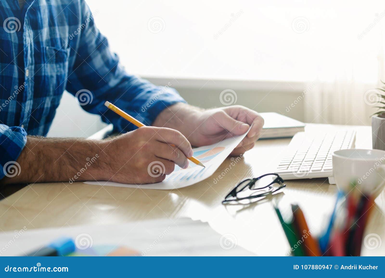 Man Analyzes the Data and Graphs in the Home Office Stock Image - Image ...