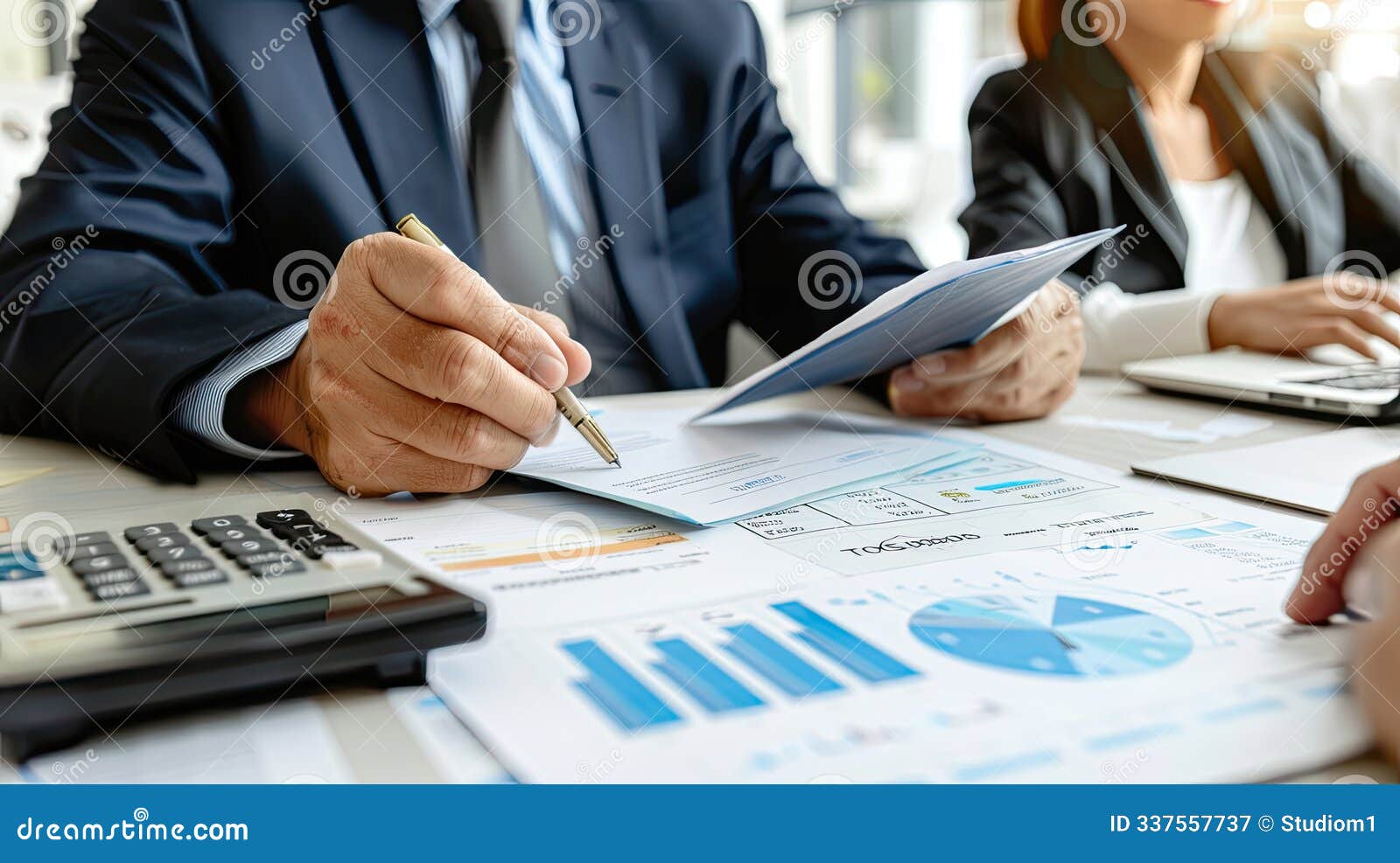 Business Analyst. Study of Financial Statements. Man in Suit Working on ...