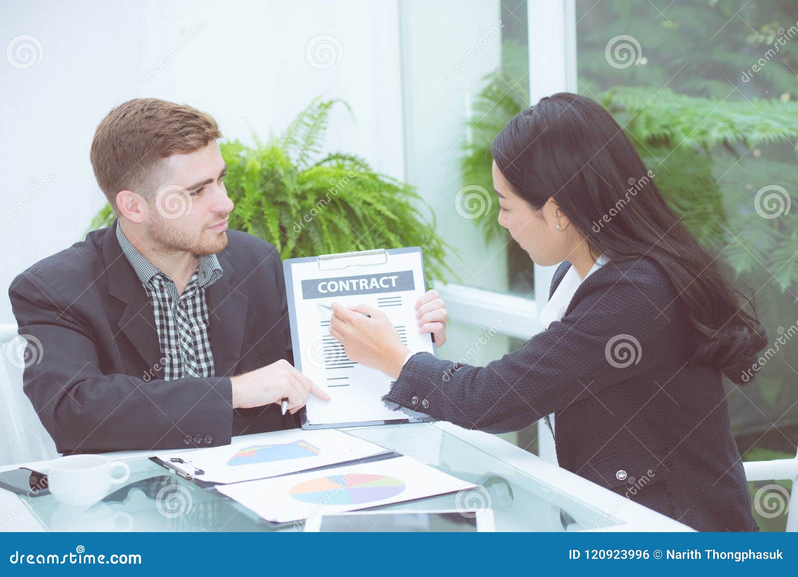 Business Asian Two People Sitting at Desk Working in Teamwork. Stock ... Business Asian Two People Sitting at Desk Working in Teamwork. Stock ...