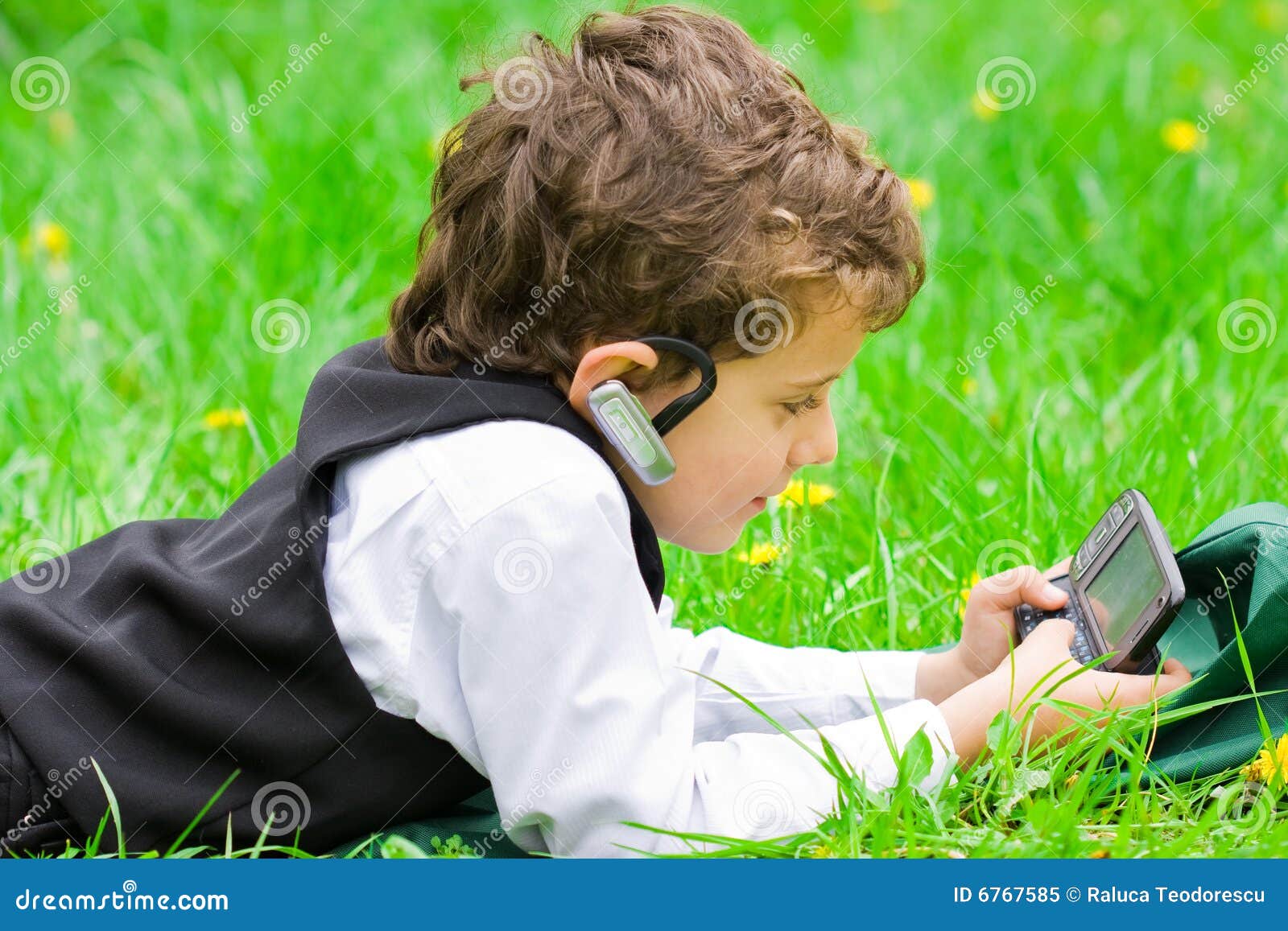 Business Boy with Mobile Phone Stock Image - Image of spring, field ...