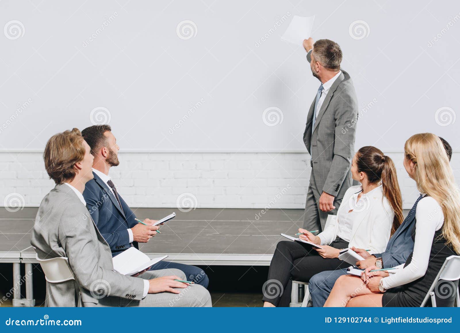 Business Coach Pointing on Board during Training Stock Photo - Image of ...