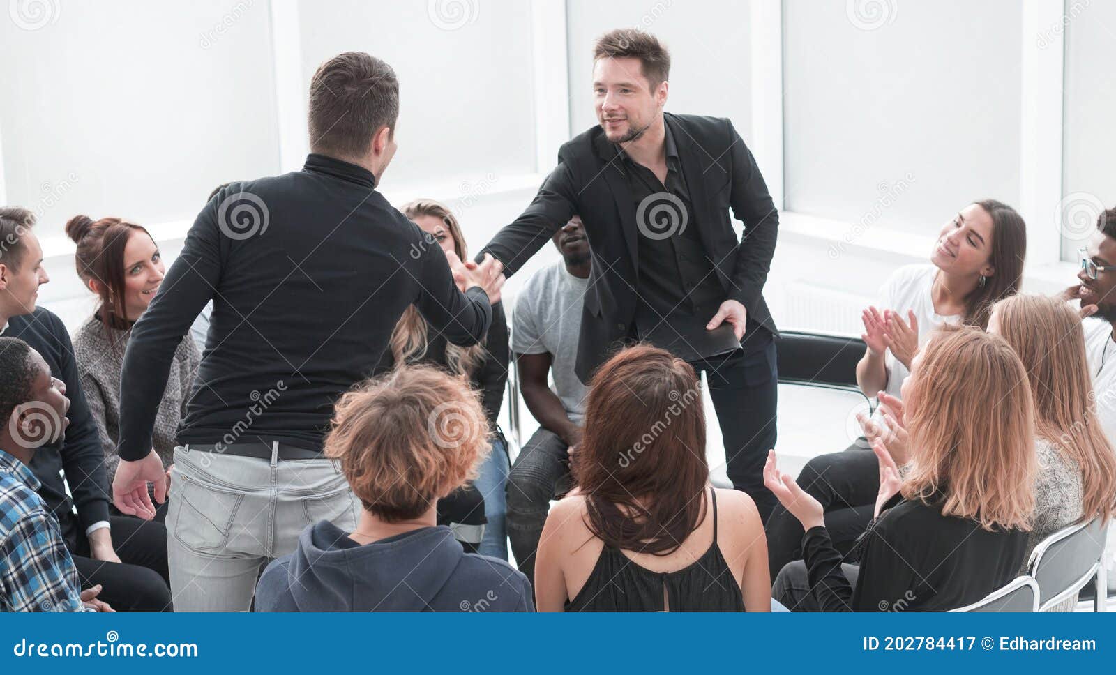 Business Coach Shaking Hands with a Seminar Participant Stock Image ...