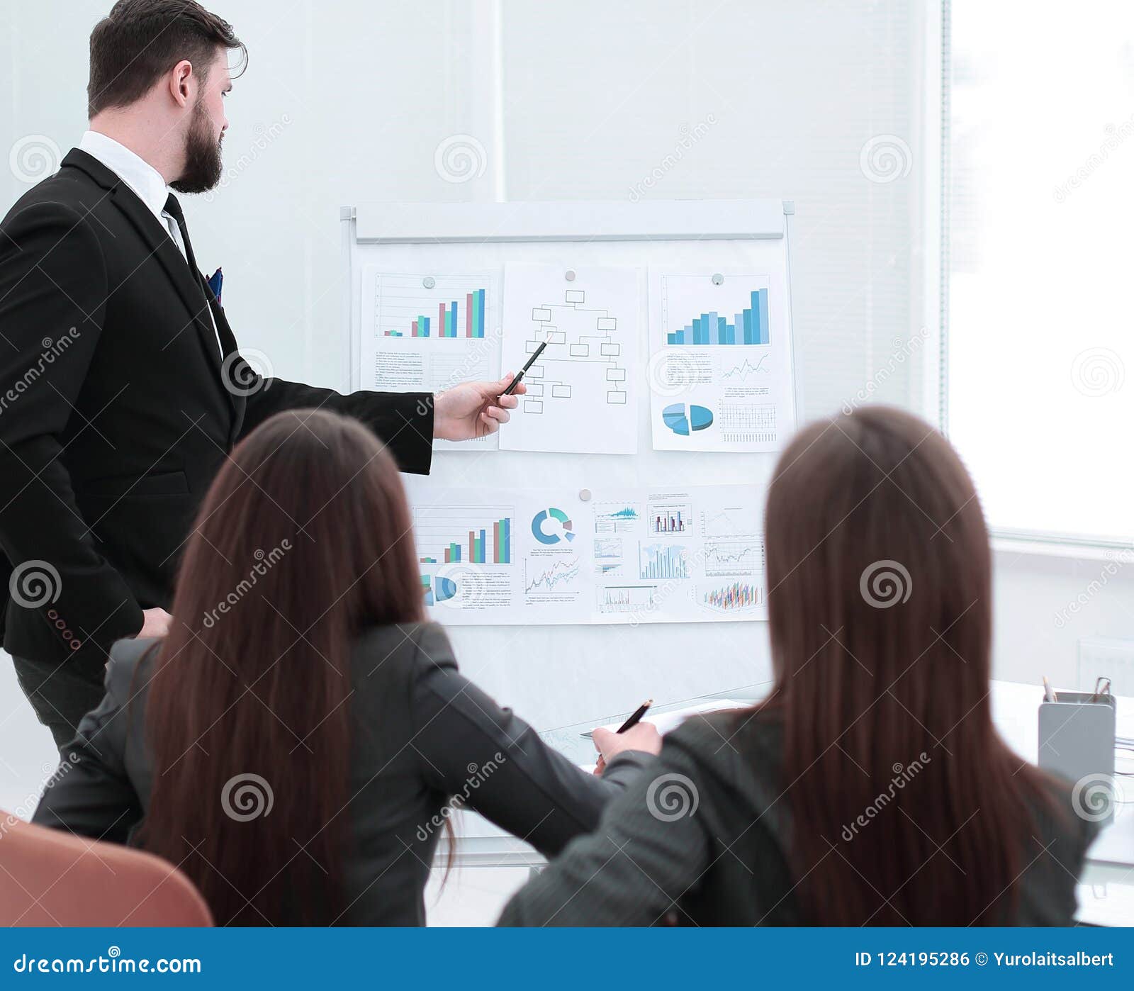 Business Coach Teaching Employees on Whiteboard at Corporate Training ...