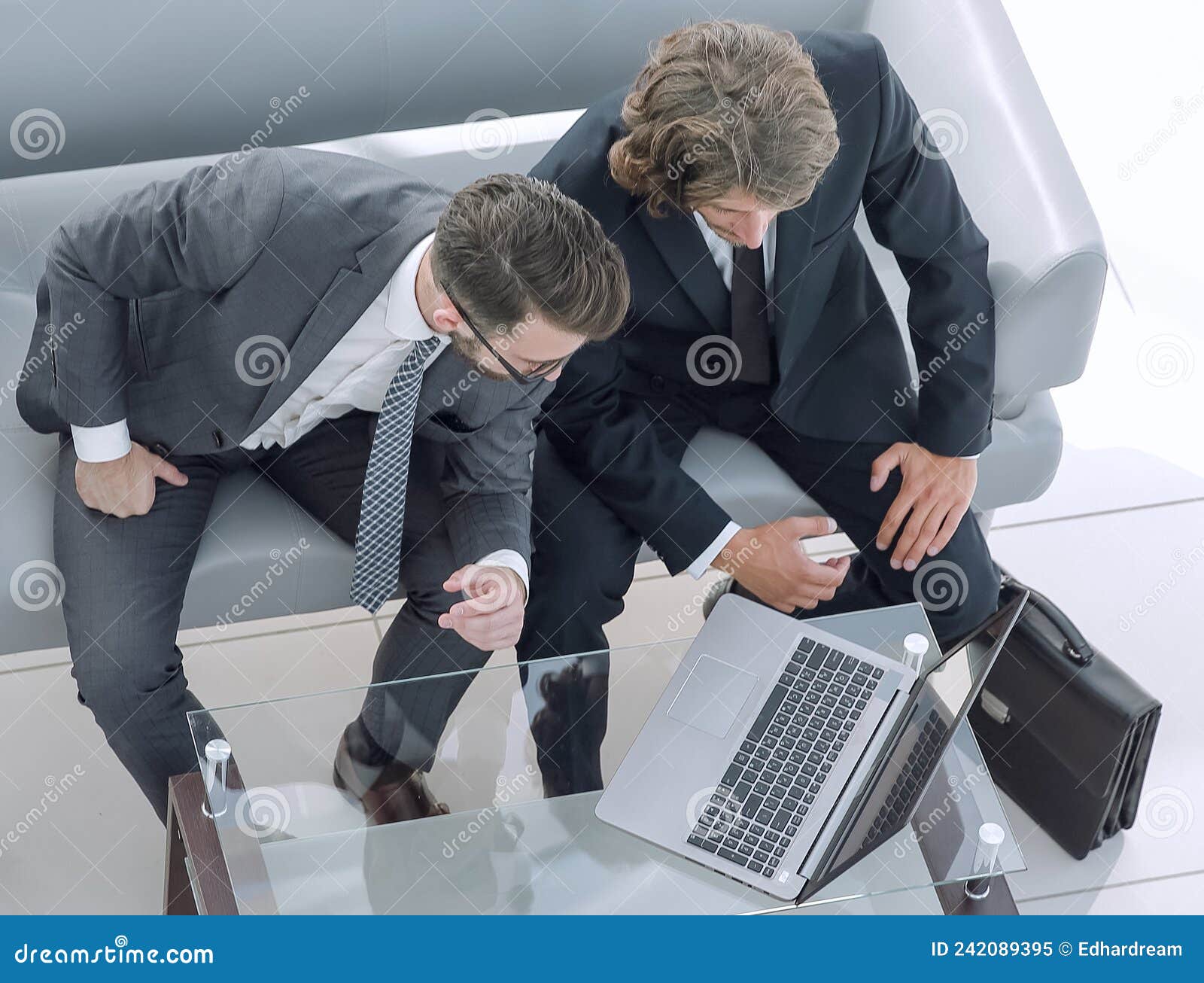 Business Colleagues Discussing Data from the Laptop. Stock Image ...