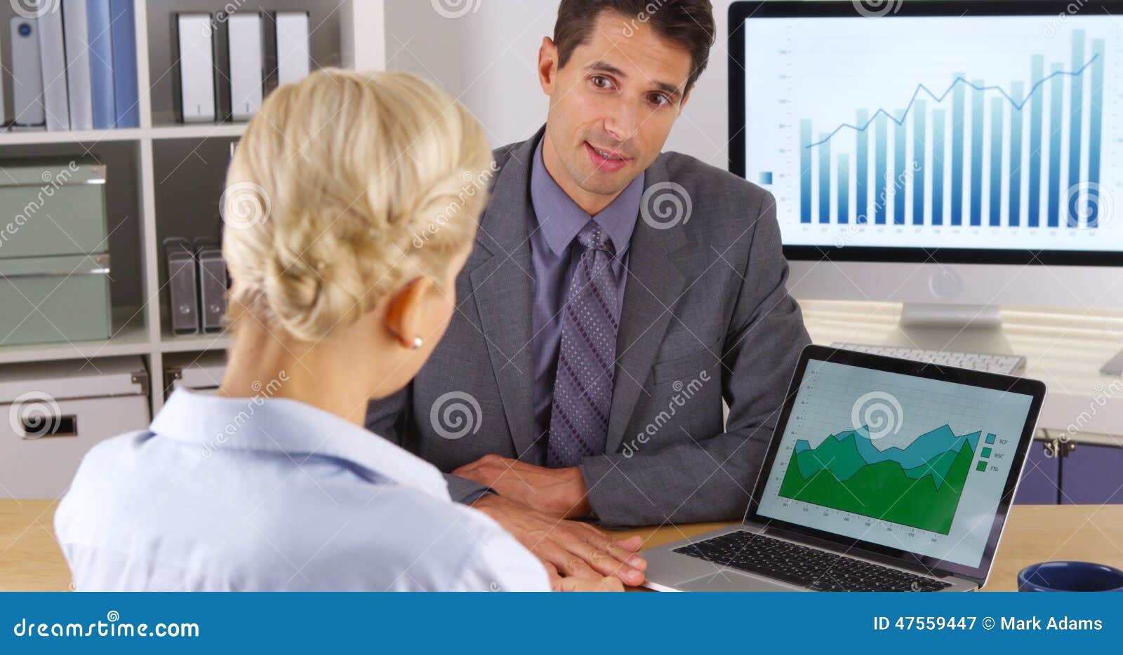 Business Colleagues Discussing Sales Data Stock Image - Image of ...