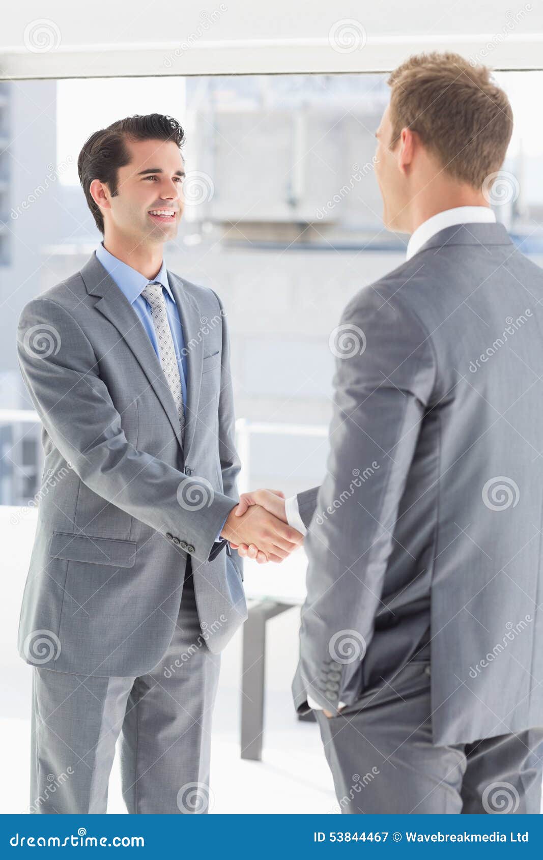 Business Colleagues Greeting Each Other Stock Image - Image of smiling ...
