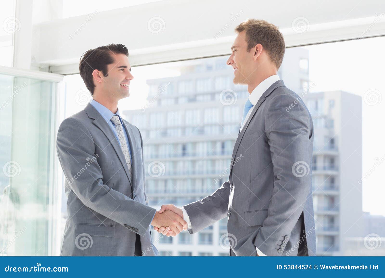 Business Colleagues Greeting Each Other Stock Photo - Image of suit ...