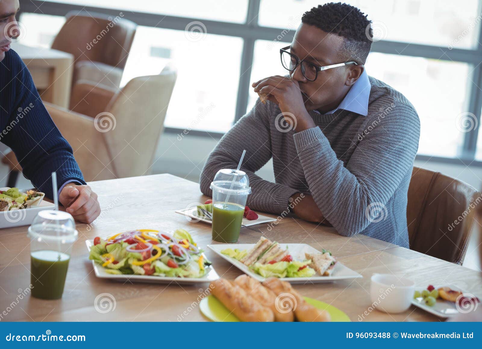 Business Colleagues Having Breakfast at Office Cafeteria Stock Photo ...
