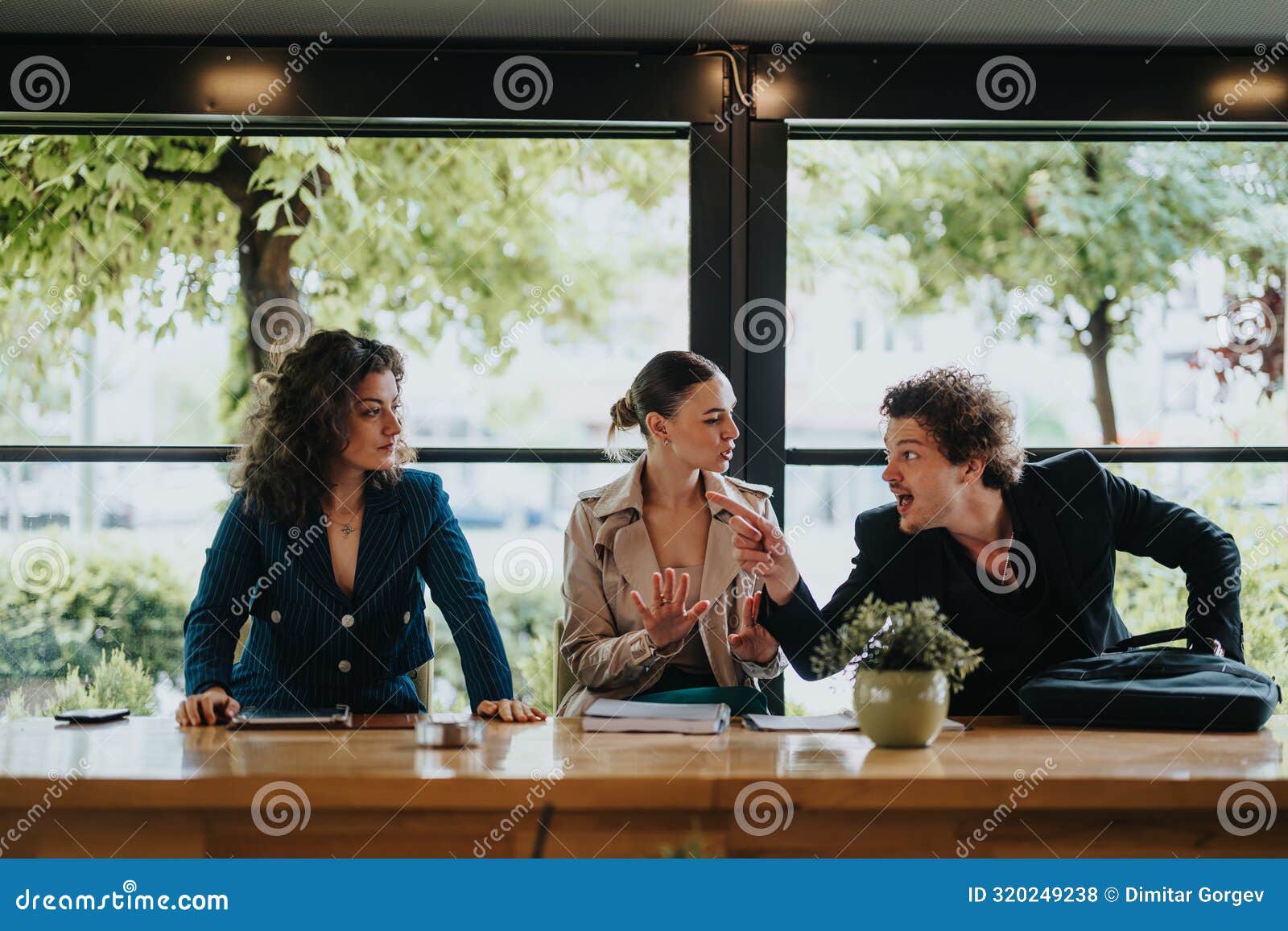 Business Colleagues Having Misunderstanding and Arguing at Desk Inside ...