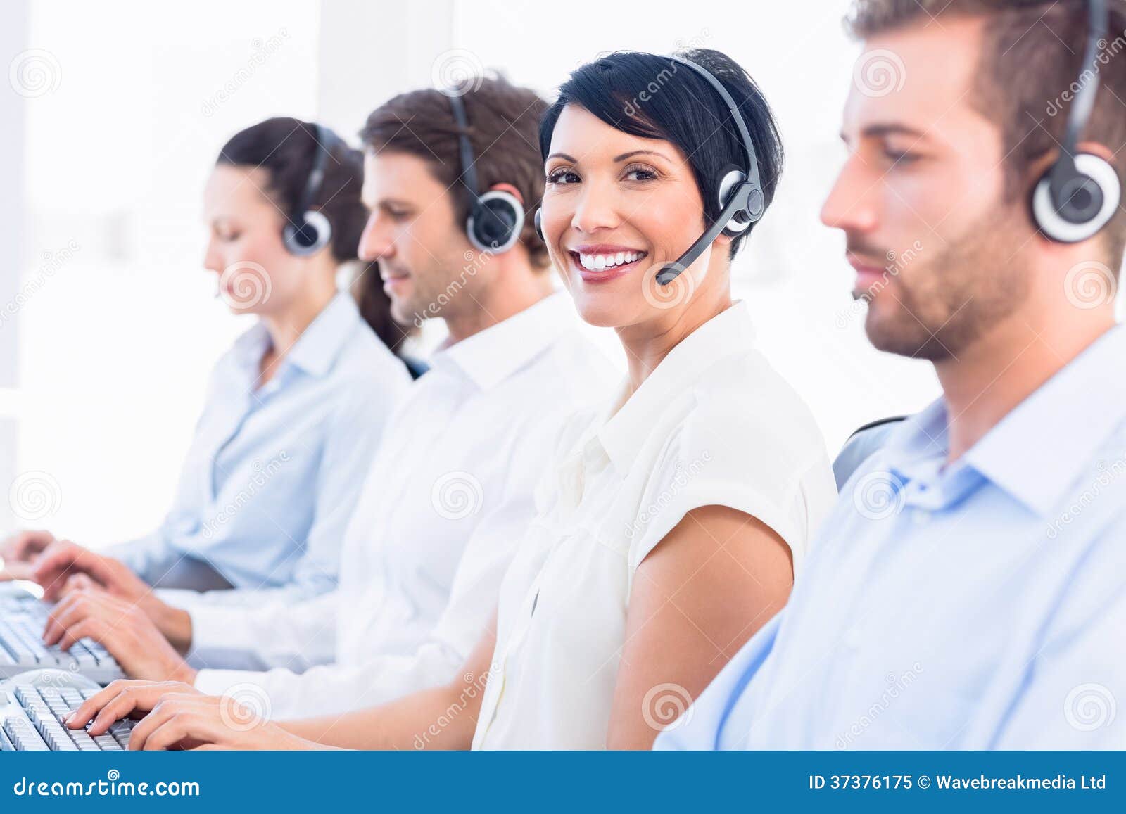 Business Colleagues with Headsets in a Row Stock Image - Image of ...