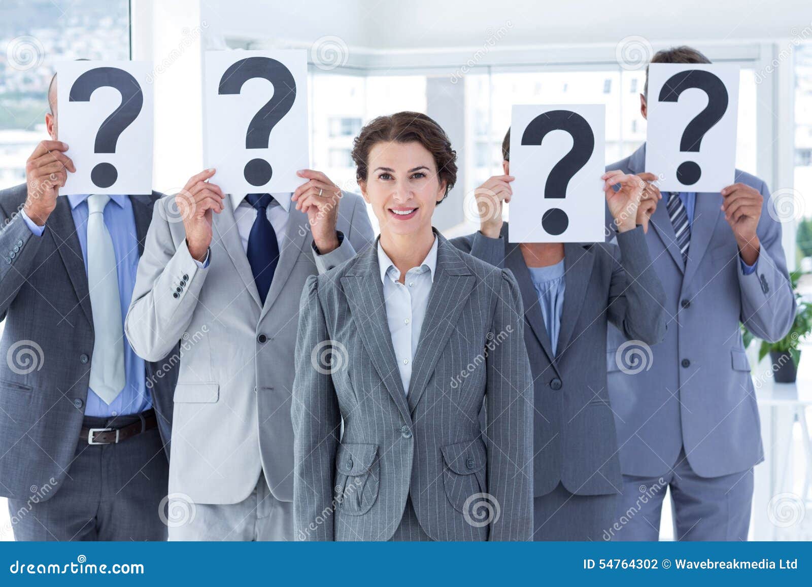 Business Colleagues Hiding Their Face with Question Mark Sign Stock ...