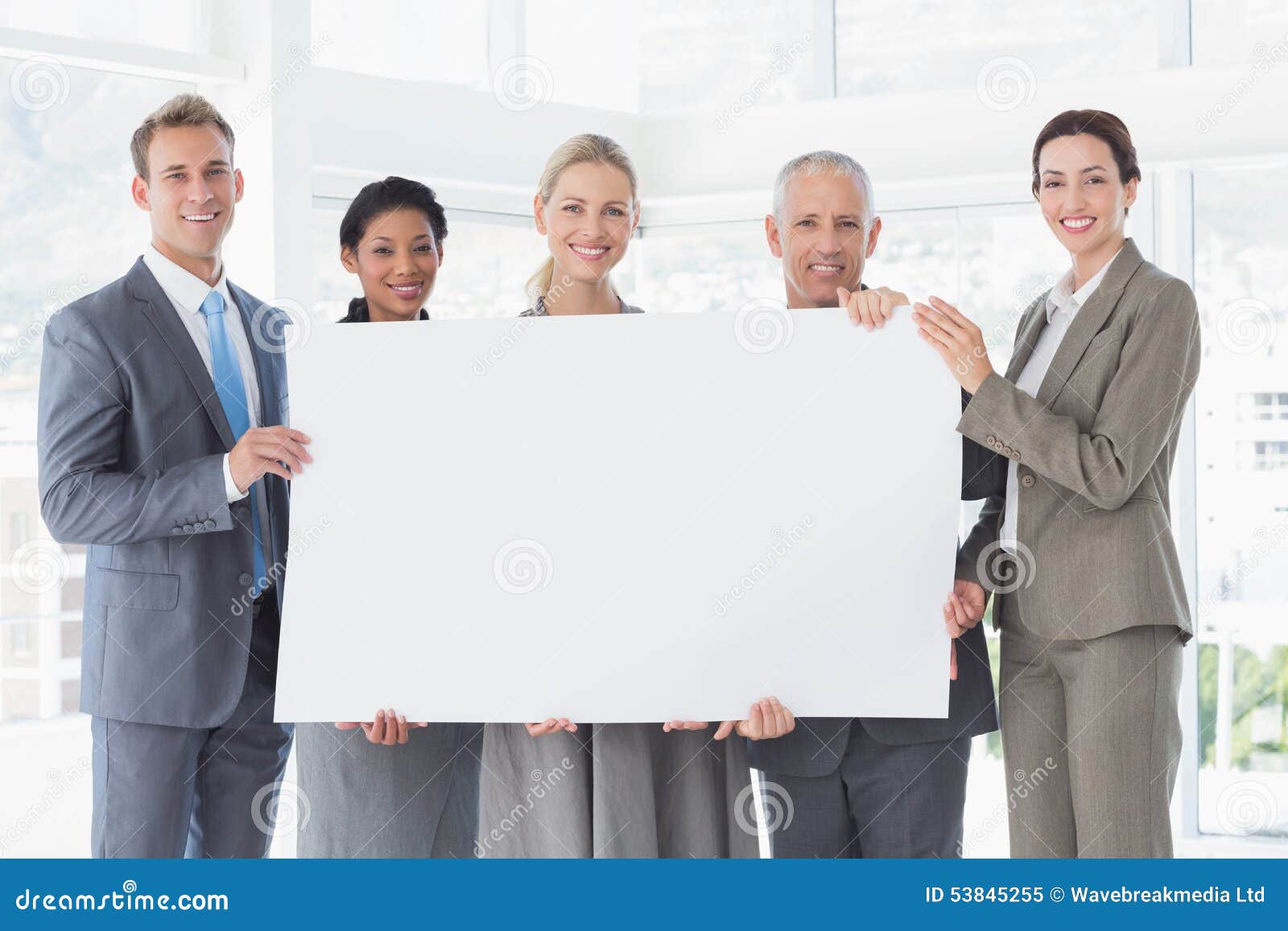 Business Colleagues Holding Poster Together Stock Image - Image of ...