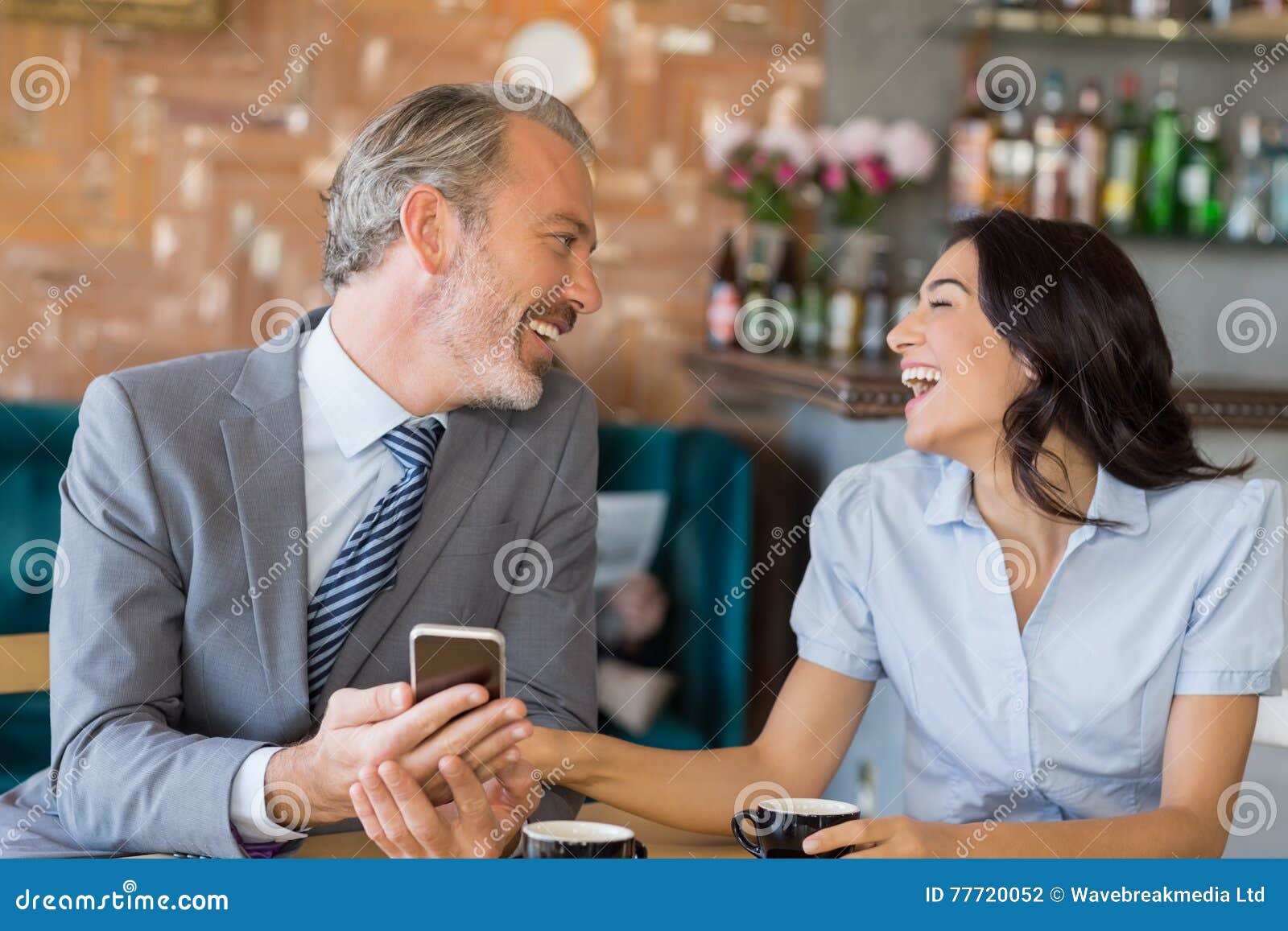 Business Colleagues Interacting with Each Other while Having Tea Stock ...