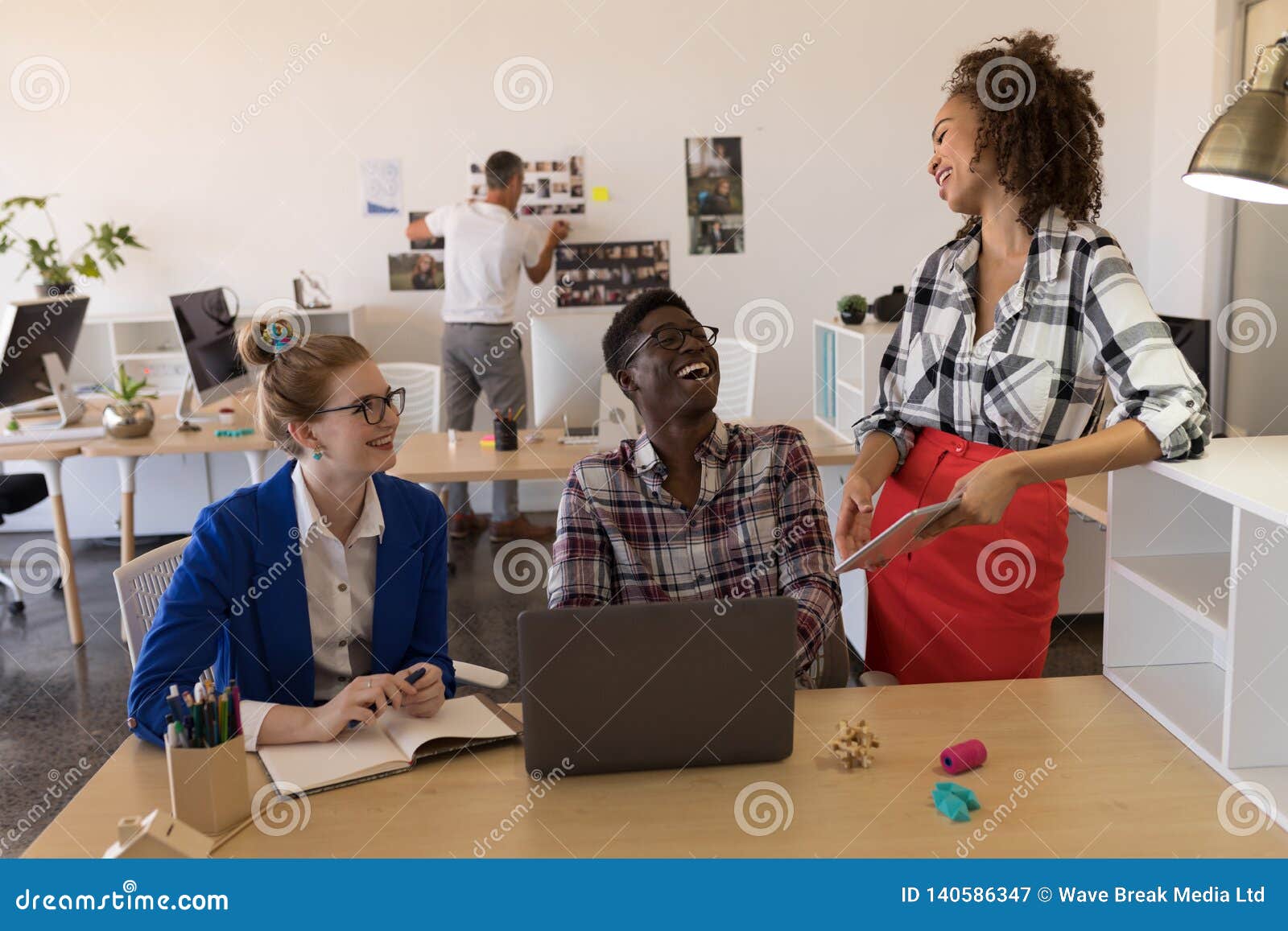 Business Colleagues Interacting with Each Other in Office Stock Image ...