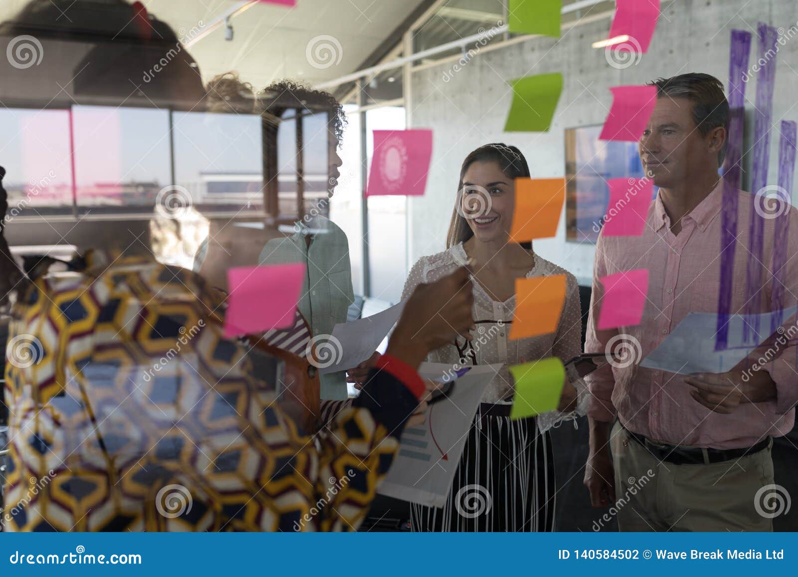 Business Colleagues Interacting with Each Other in Office Stock Photo ...