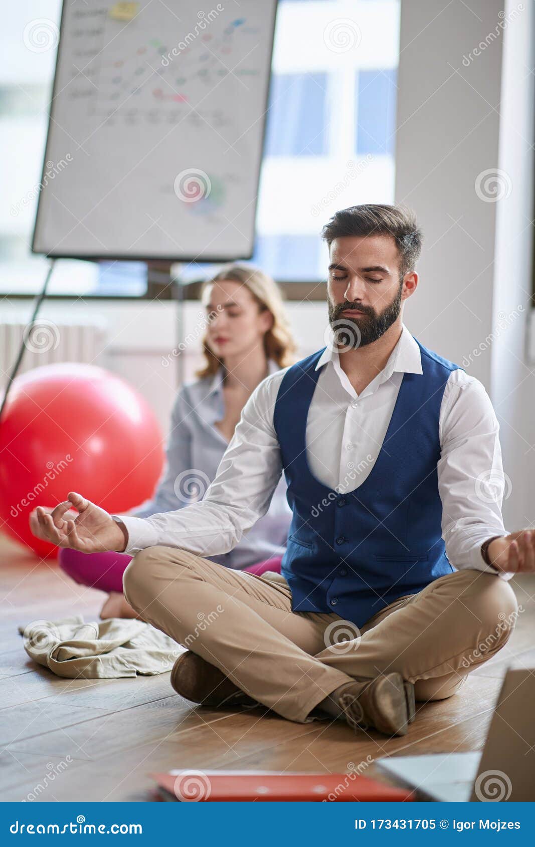 Business Colleagues Meditating at Work, Sitting on the Floor in Modern ...