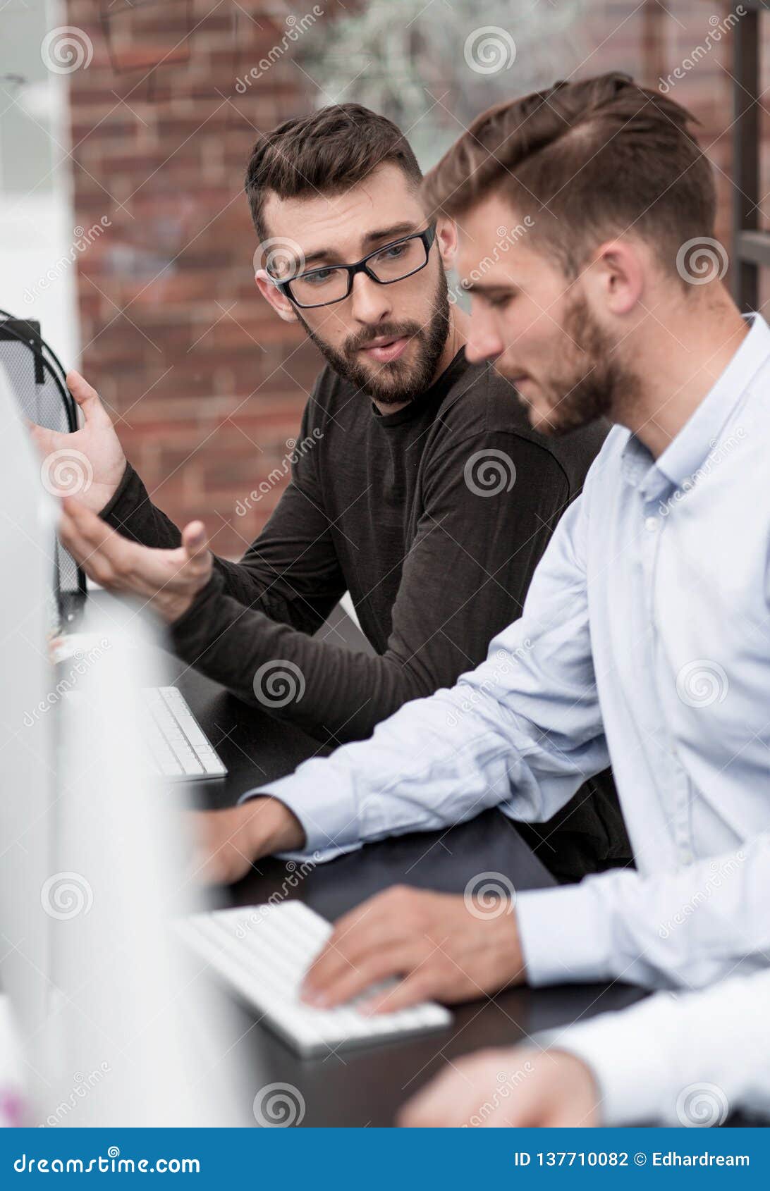 Business Colleagues Talk, Sitting at a Computer Table Stock Photo ...