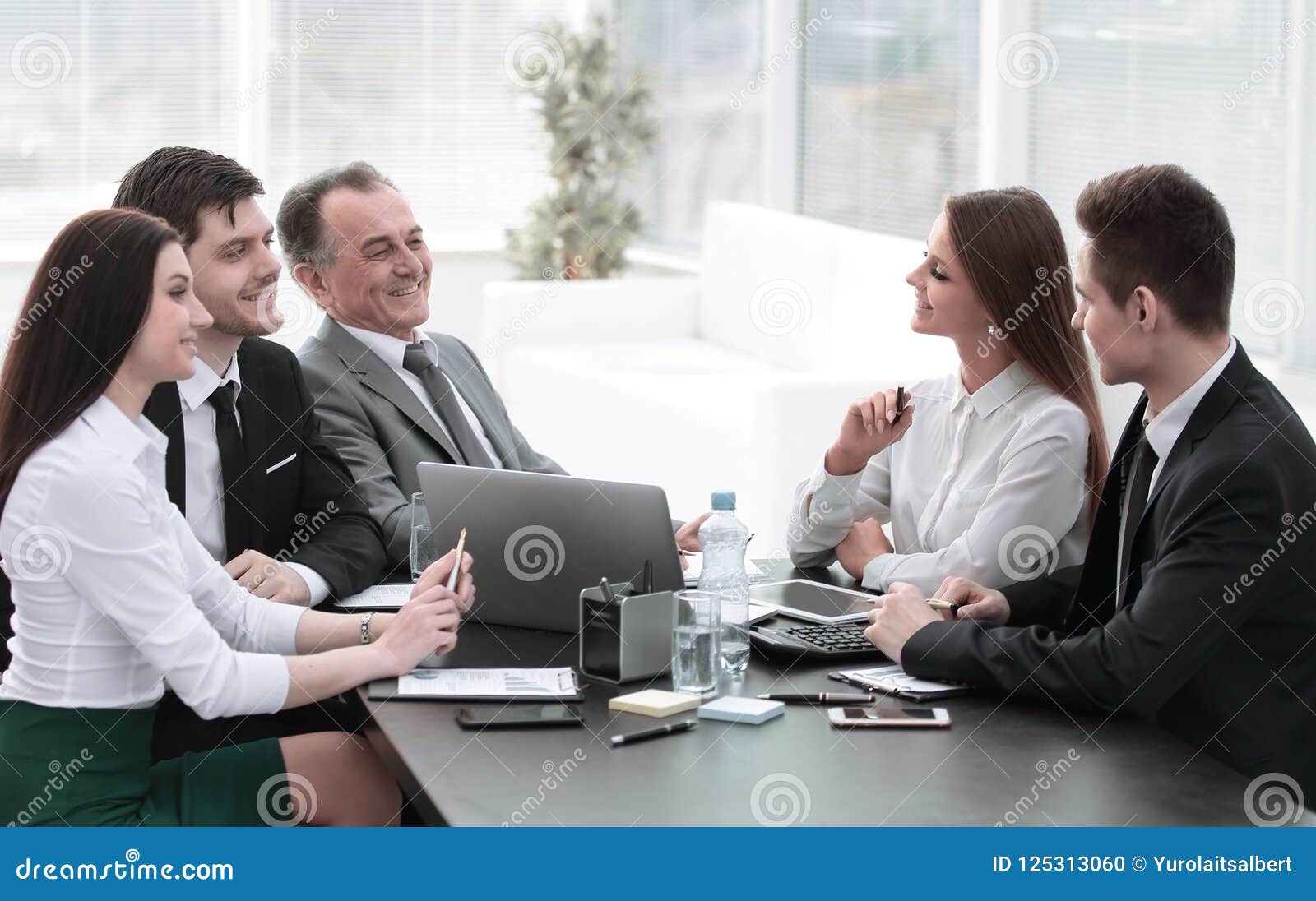 Business Colleagues Talking at Desk in the Office Stock Photo - Image ... Business Colleagues Talking at Desk in the Office Stock Photo - Image ...