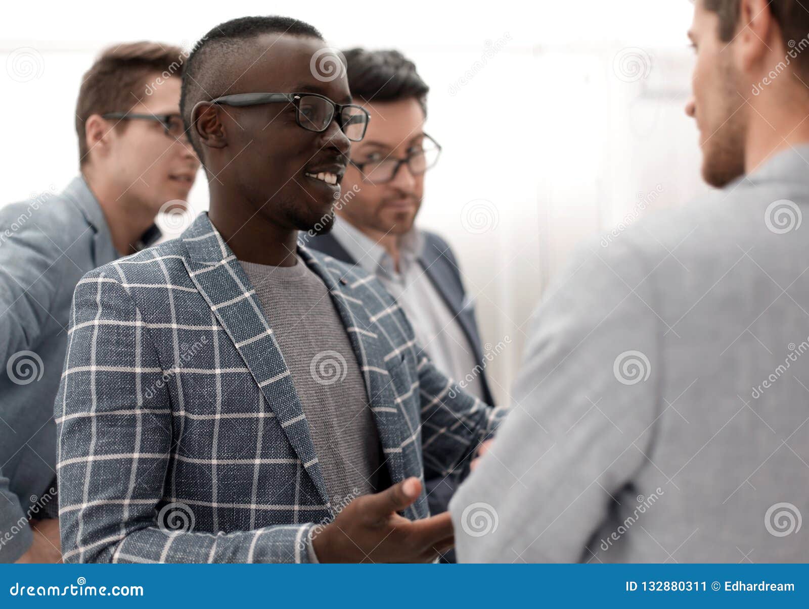 Business Colleagues Talking while Standing in Office Stock Image ...