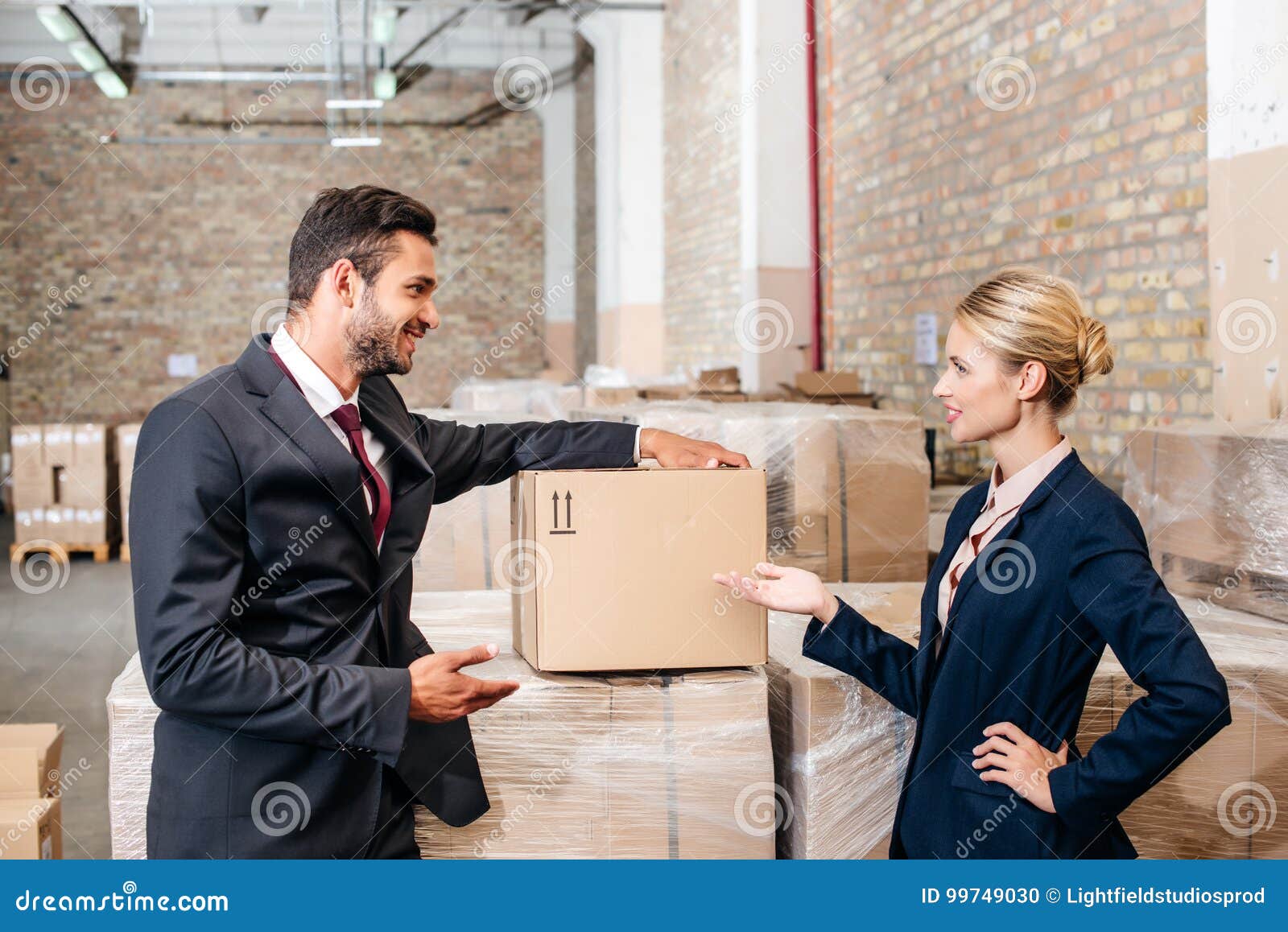 Business Colleagues Talking at Warehouse Stock Photo - Image of ...