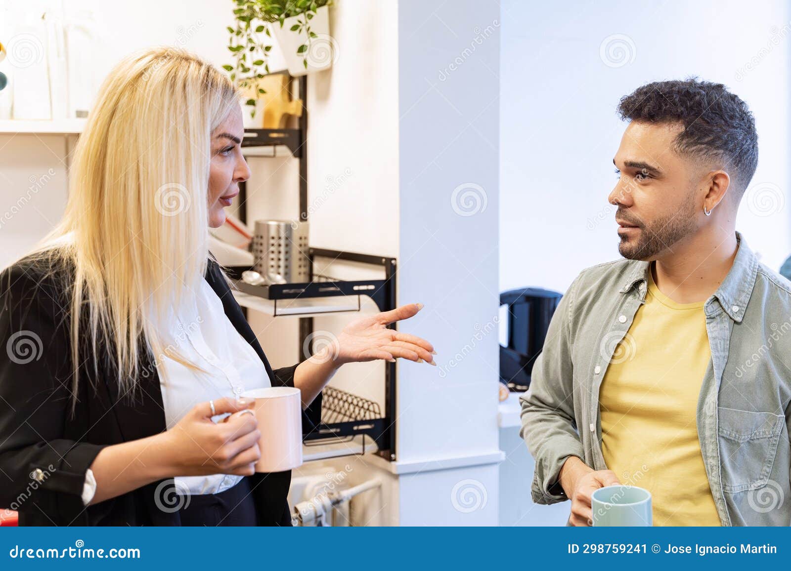 Business Colleagues Talking about Work while Having a Coffee Break at ...