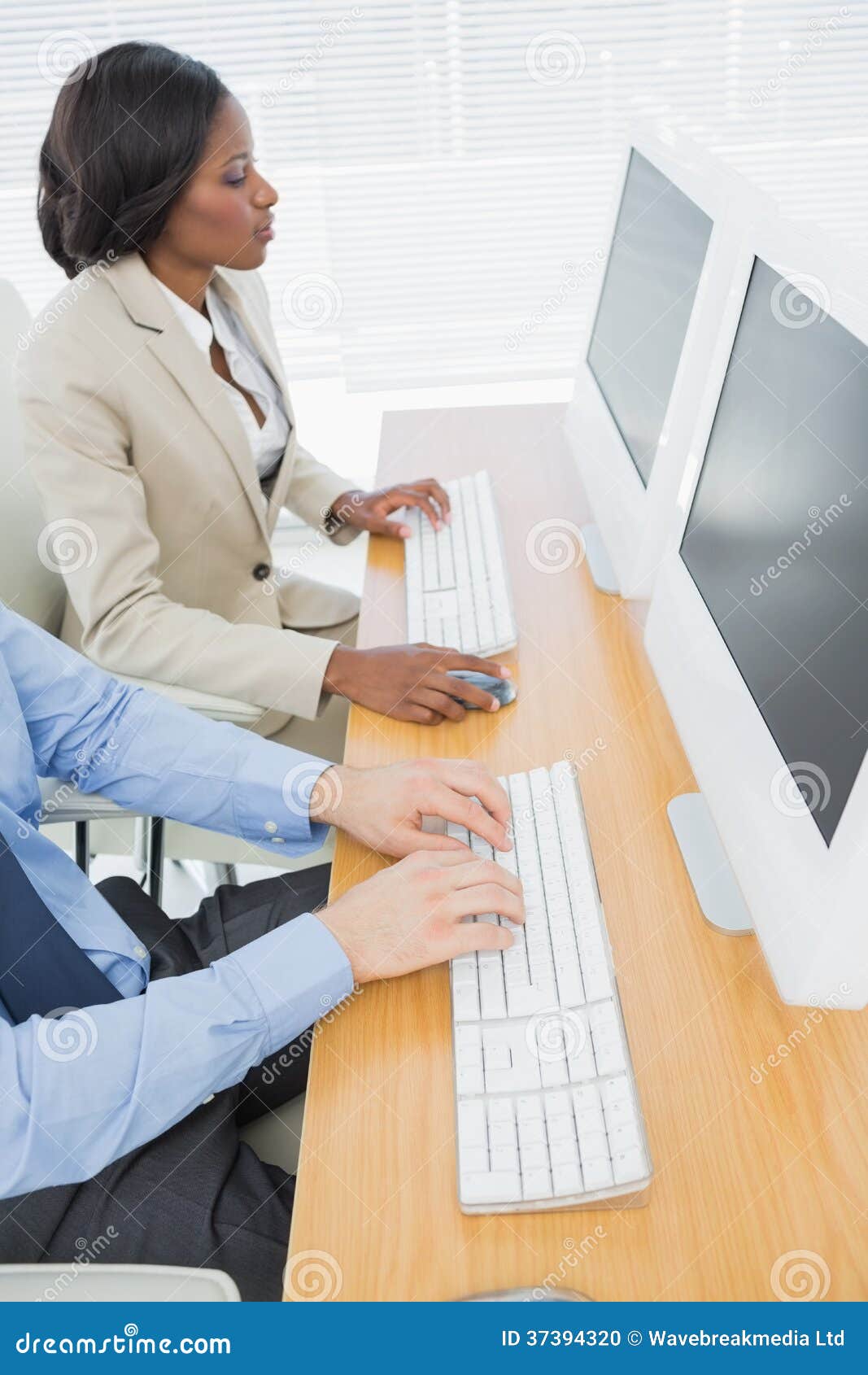 Business Colleagues Using Computers at Desk Stock Photo - Image of ...