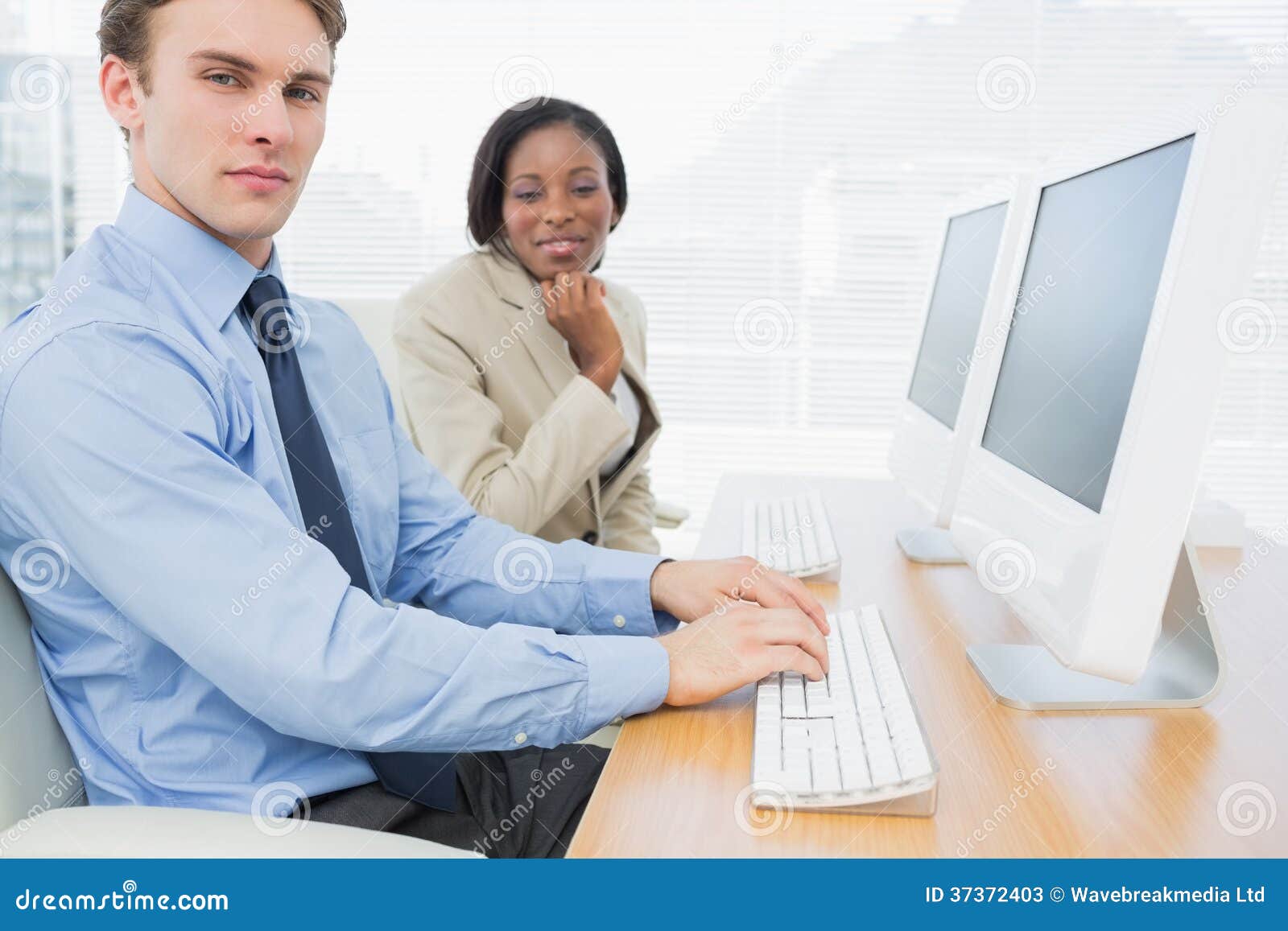 Business Colleagues Using Computers at Desk Stock Image - Image of ...