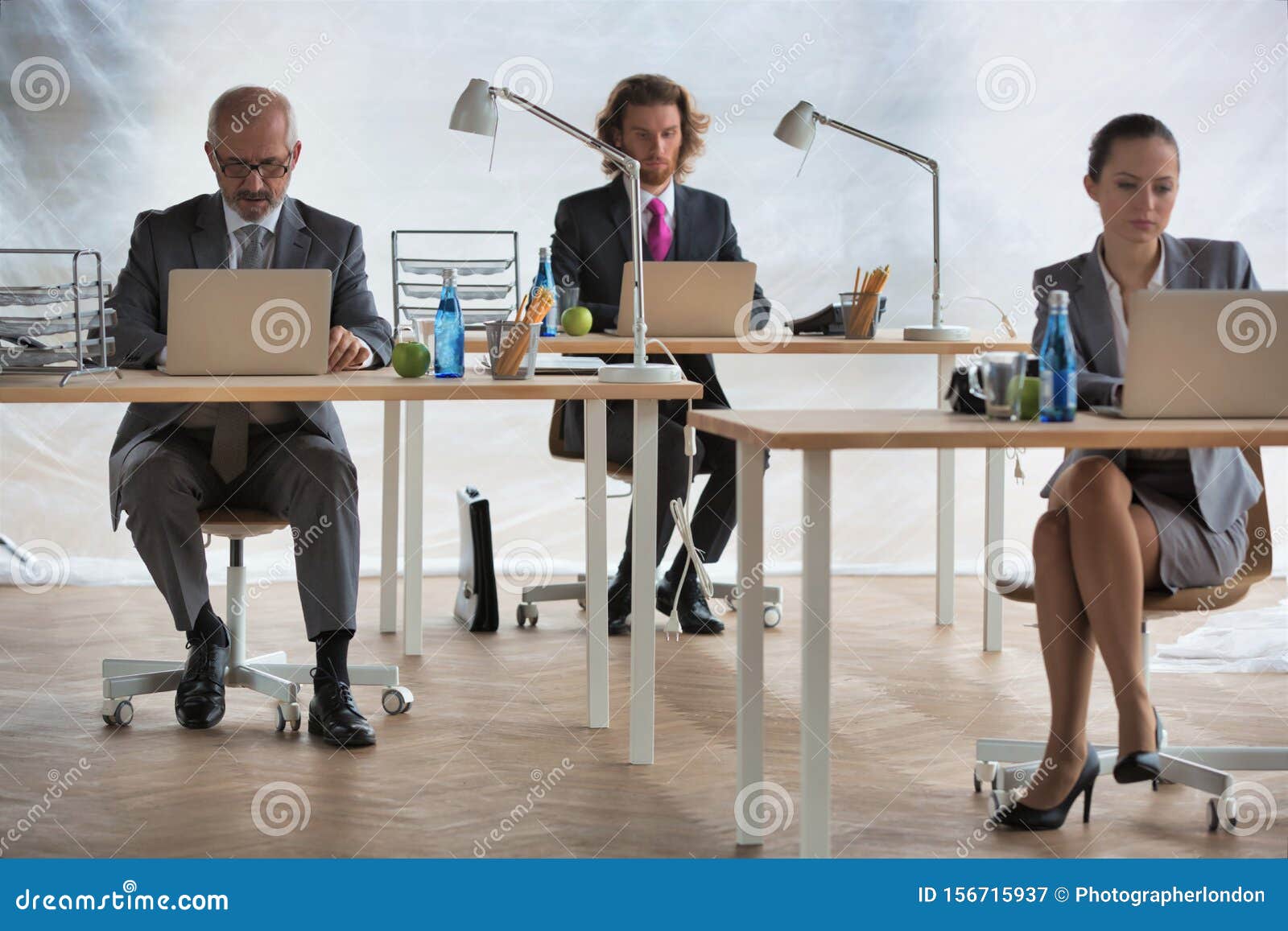 Business Colleagues Using Laptops at Desks in Office Stock Image ...
