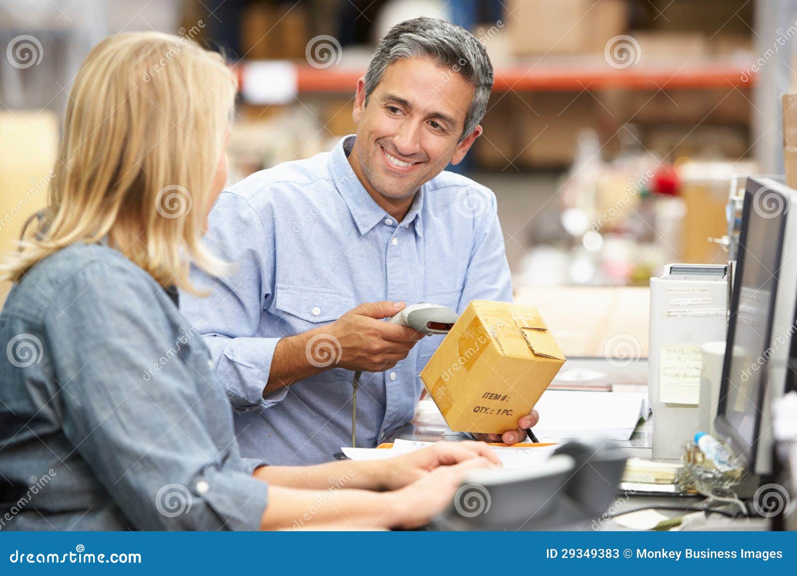 Business Colleagues Working at Desk in Warehouse Stock Image - Image of ...