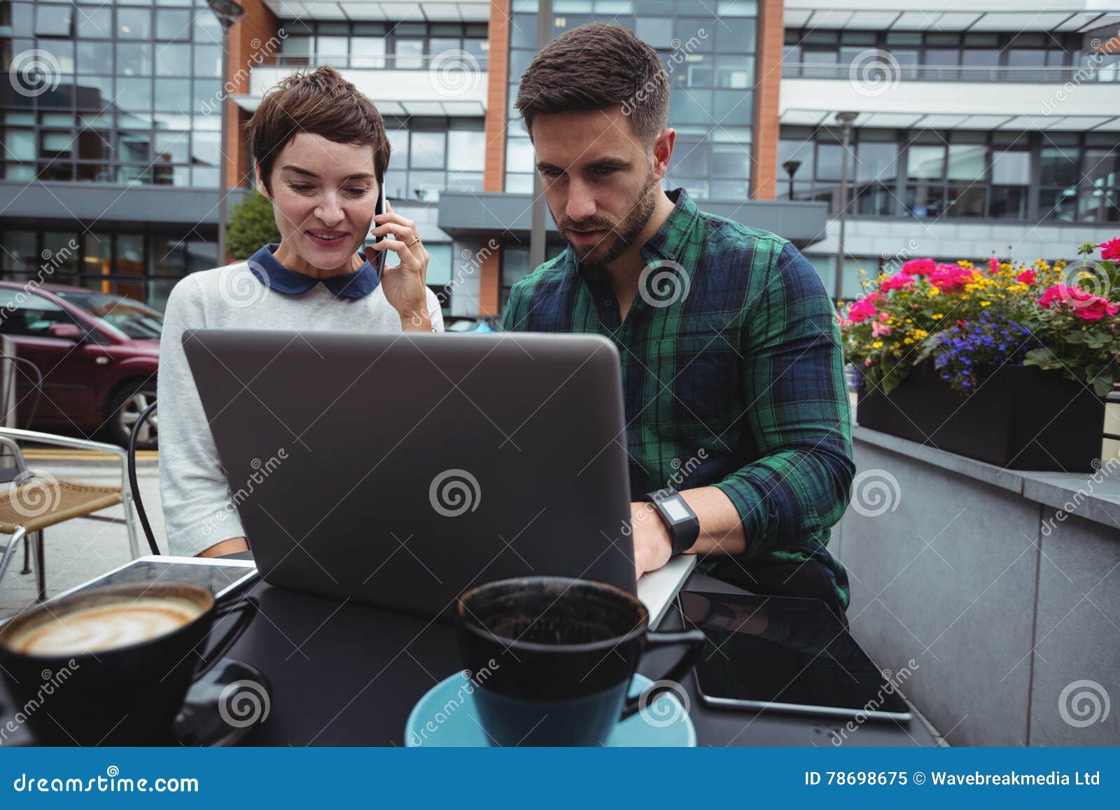 Business Colleagues Working while Having Coffee in Cafeteria Stock ...
