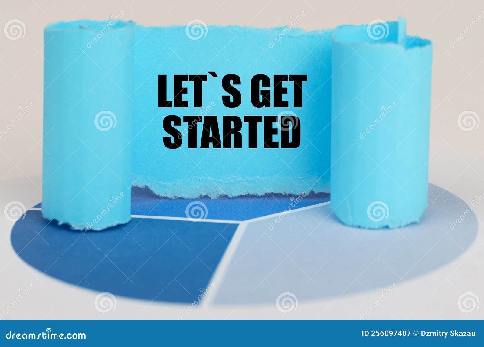 On the Blue Diagram is a Twisted Paper Sign with the Inscription - LET ... On the Blue Diagram is a Twisted Paper Sign with the Inscription - LET ...