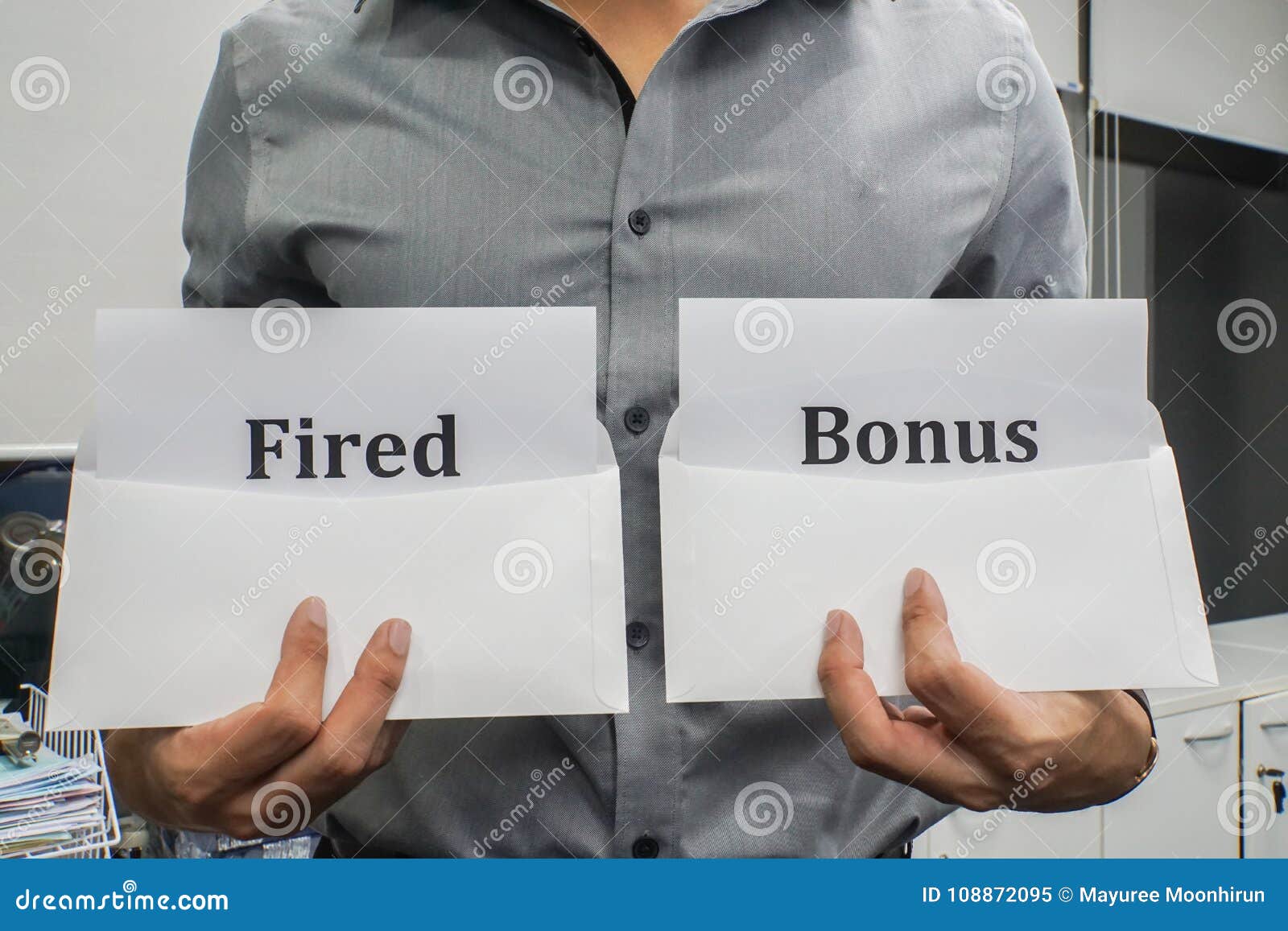 Business Concept - Businessman Hold Fired and Bonus Sign for Work ...