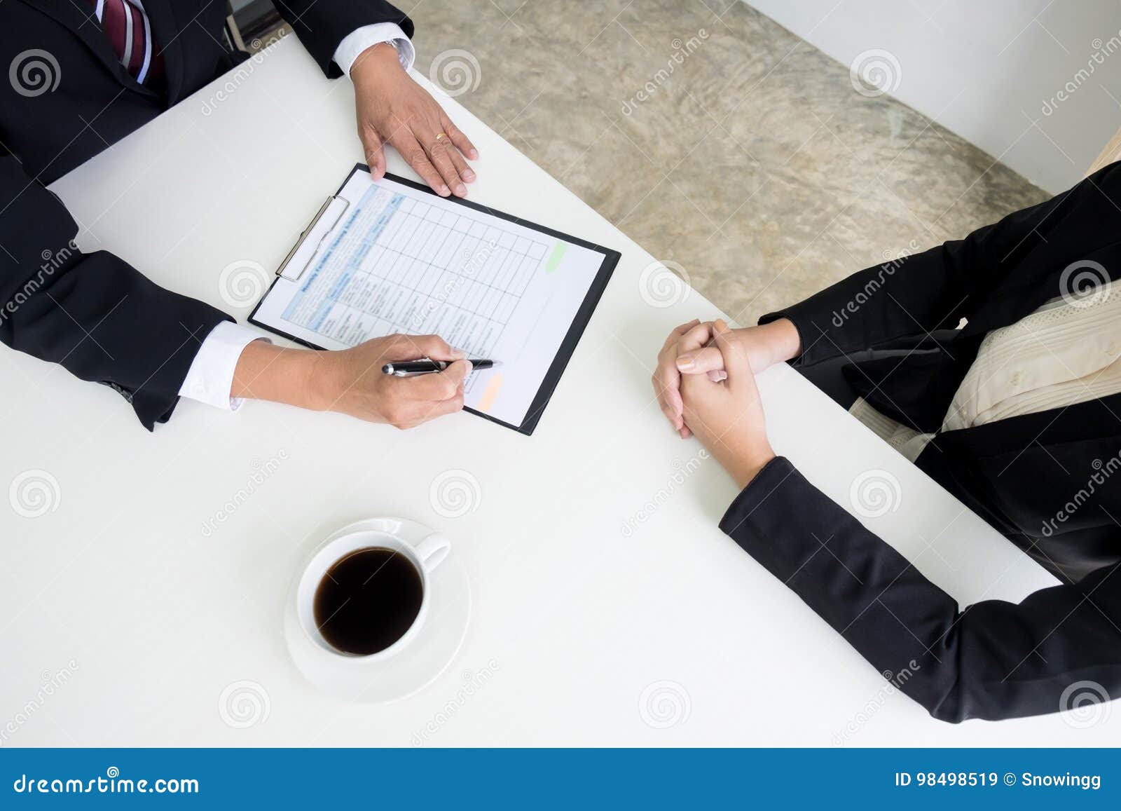 Business Concept - Executives at Desk Discussion Sales Performance in a ...