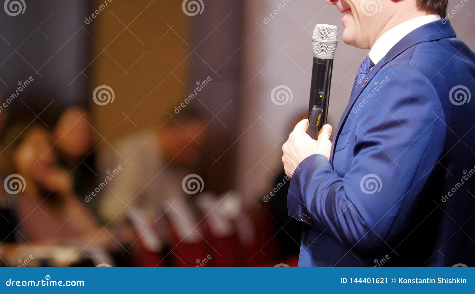 A Business Conference in the Hall. a Man Talking on the Stage Using ...