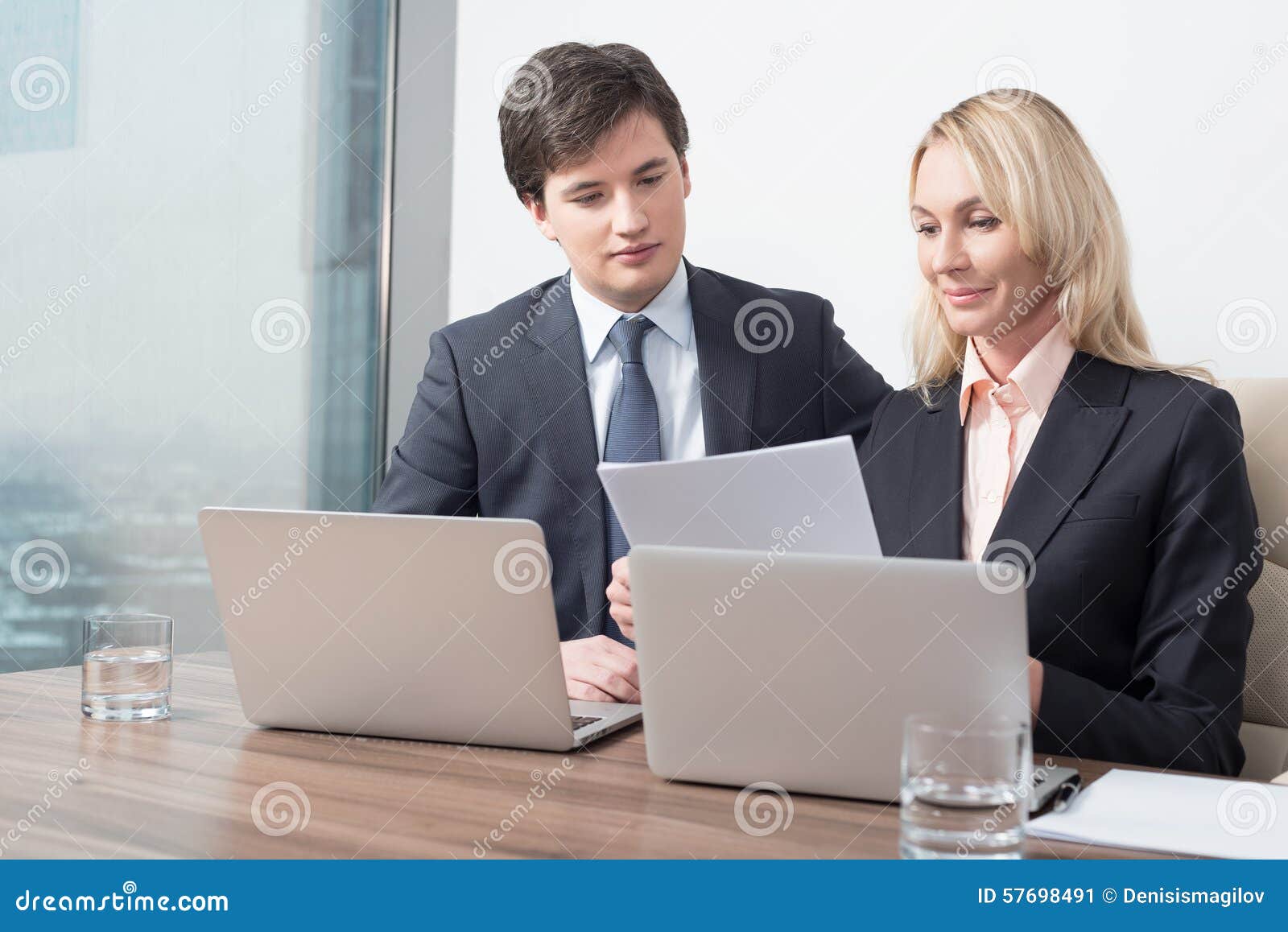 Business Couple is Double Checking Some Essential Business Information ...