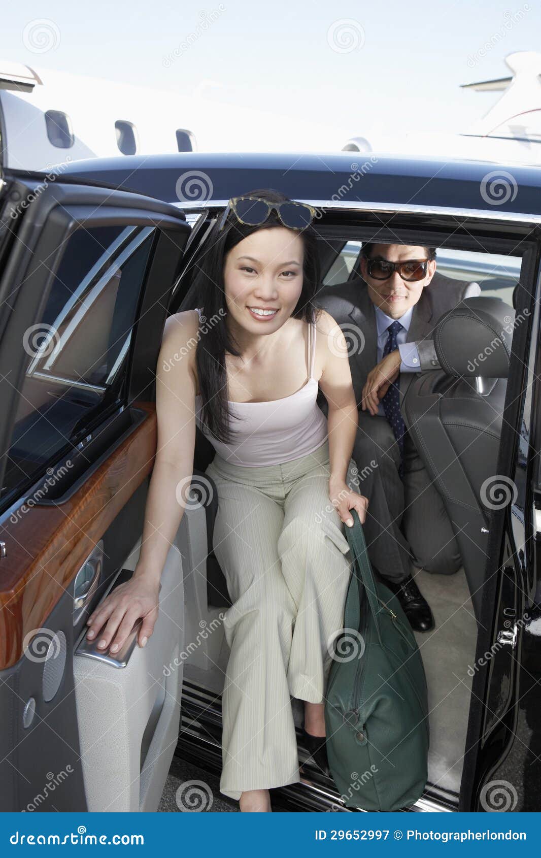 Business Couple Getting Down a Car at Airfield Stock Image - Image of ...