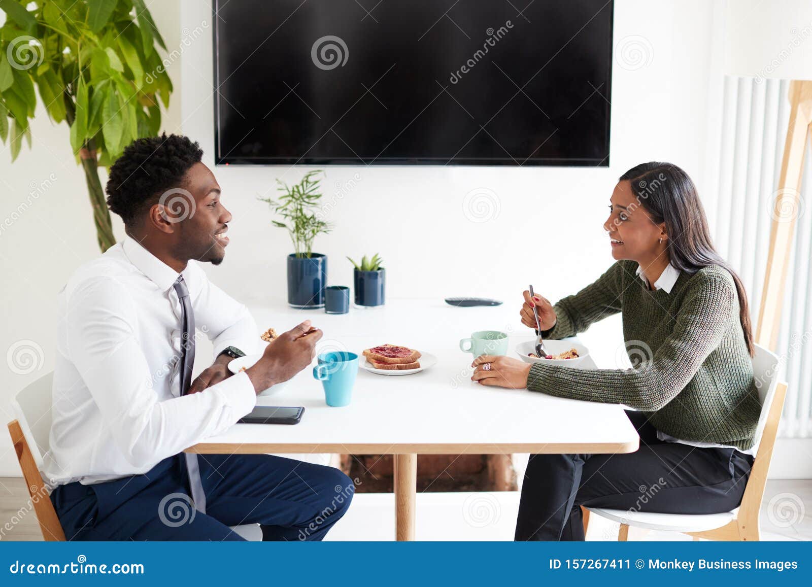Business Couple at Home Eating Breakfast before Leaving for Work Stock ...
