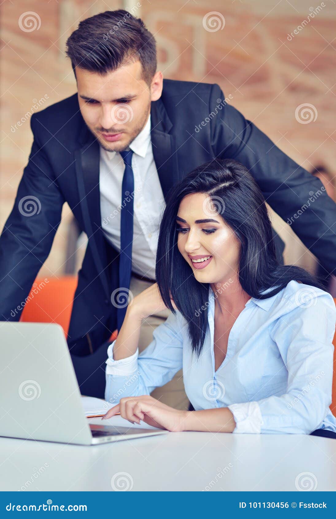 Business Couple in an Office Working on the Computer Stock Photo ...