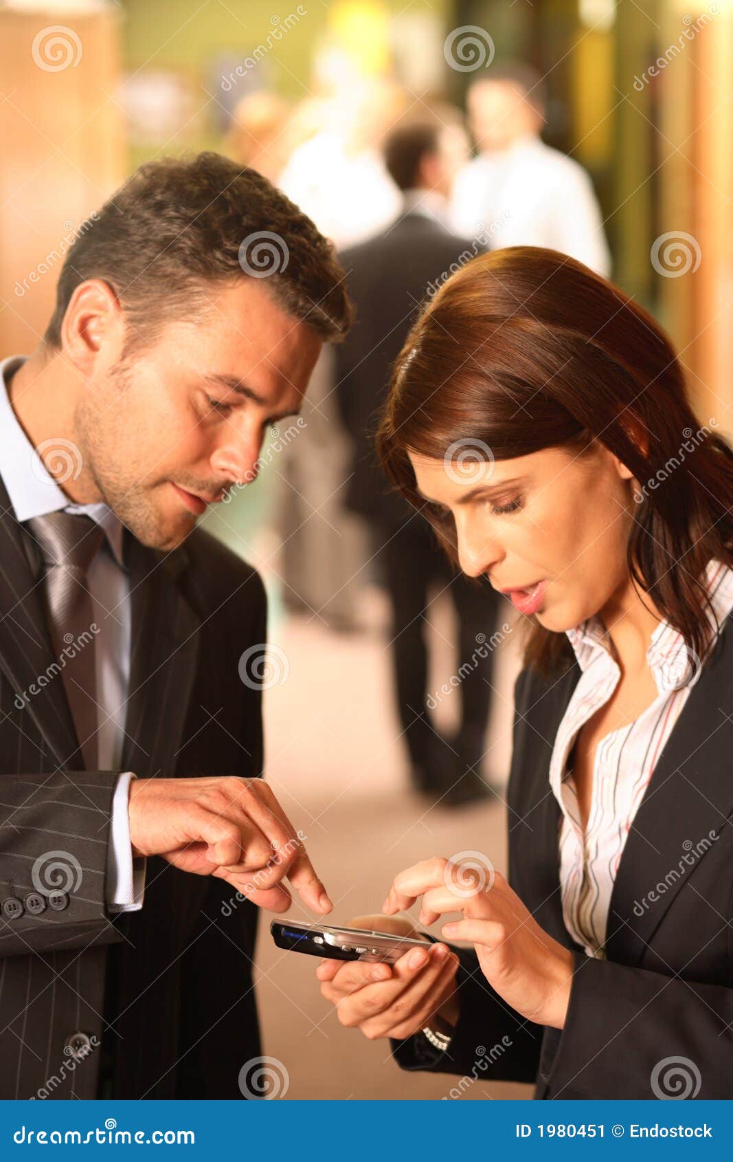 Business Couple Using Cellphone Stock Image - Image of electronic ...