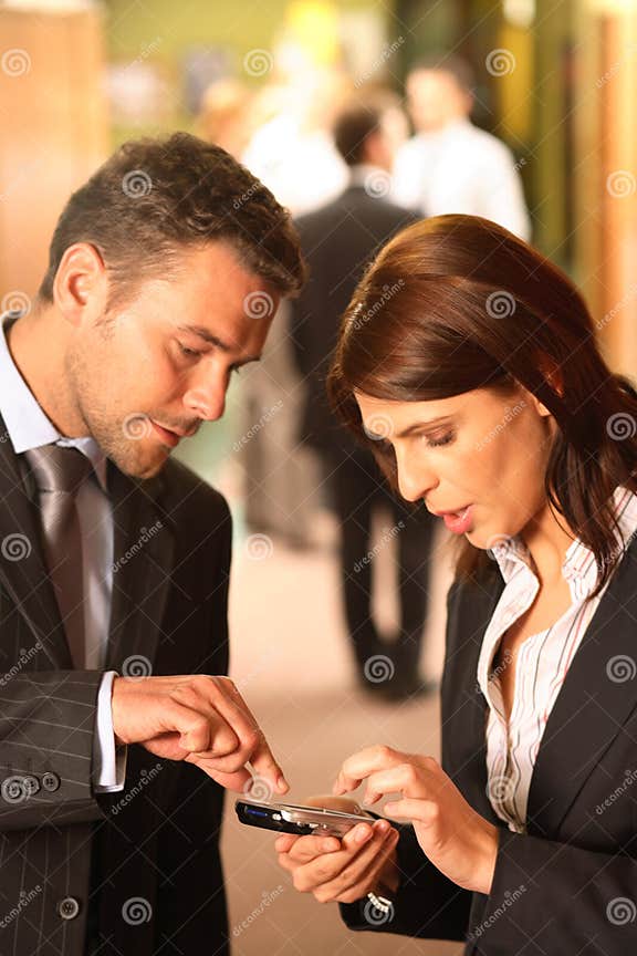 Business Couple Using Cellphone Stock Image - Image of electronic ...