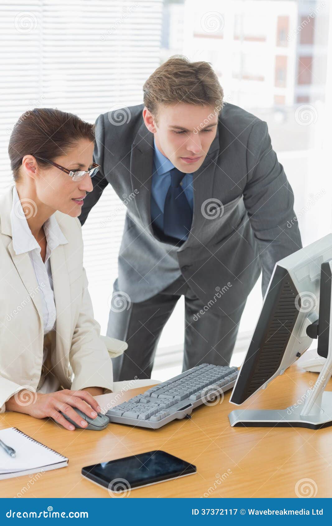 Business Couple Using Computer at Office Desk Stock Image - Image of ...