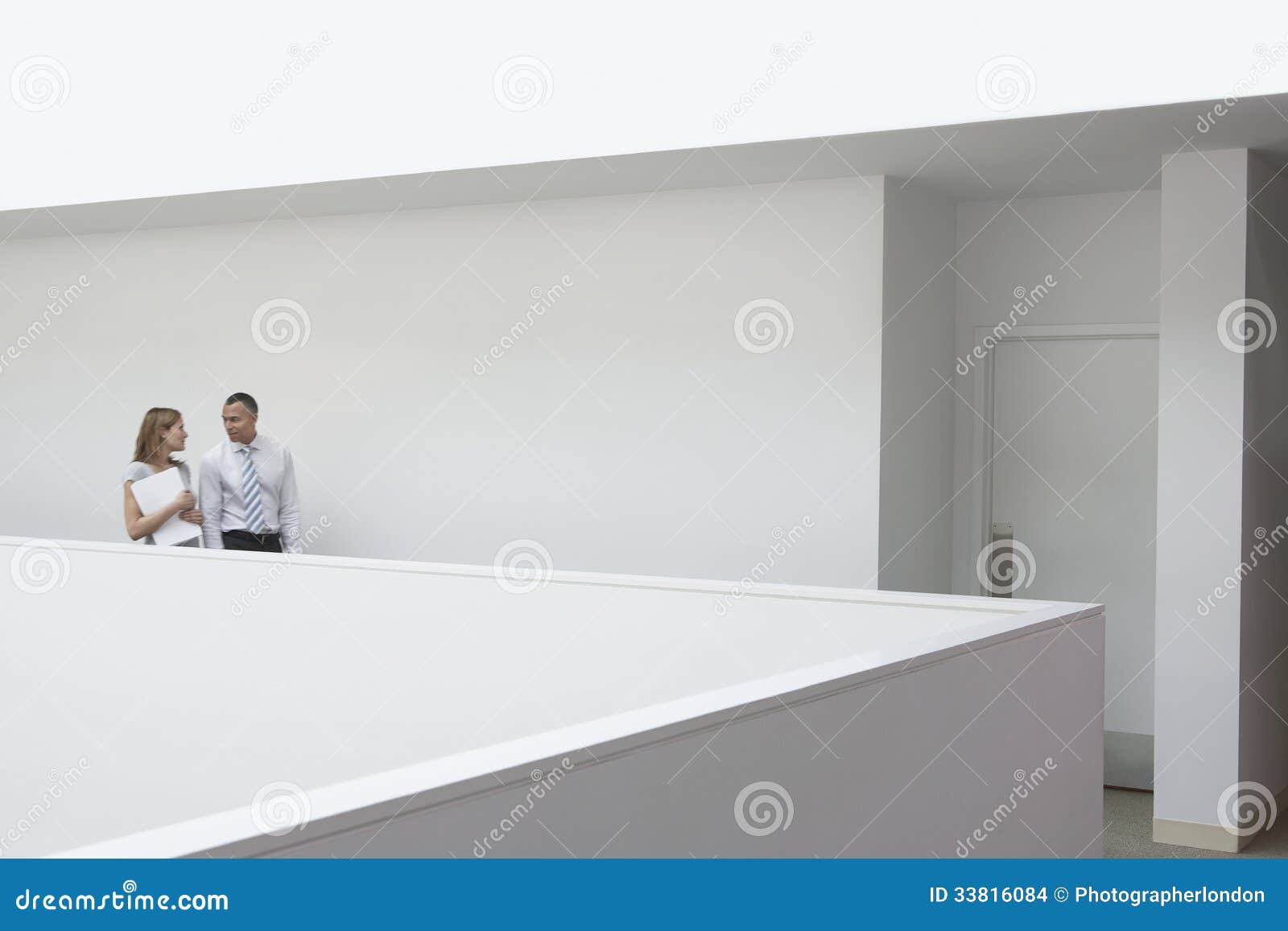 Business Couple Walking through Hallway Stock Photo - Image of ...