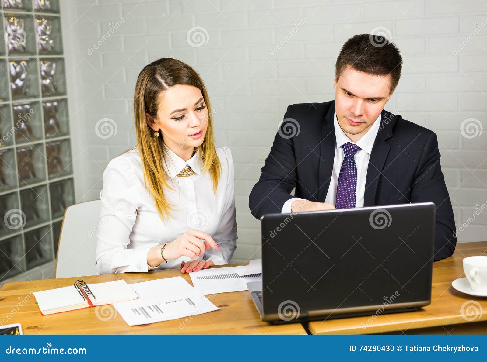 Business Couple Working Together on Project at Modern Startup Office ...