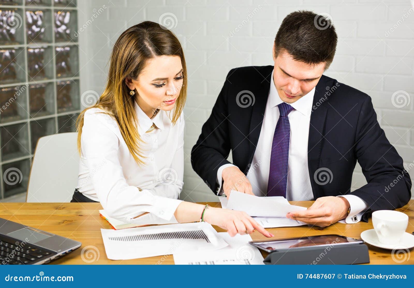 Business Couple Working Together on Project at Modern Startup Office ...