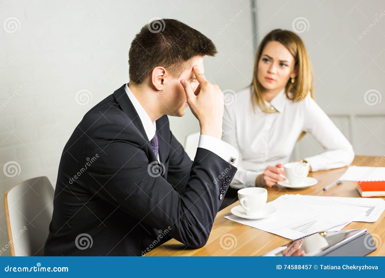 Business Couple Working Together on Project at Modern Startup Office ...