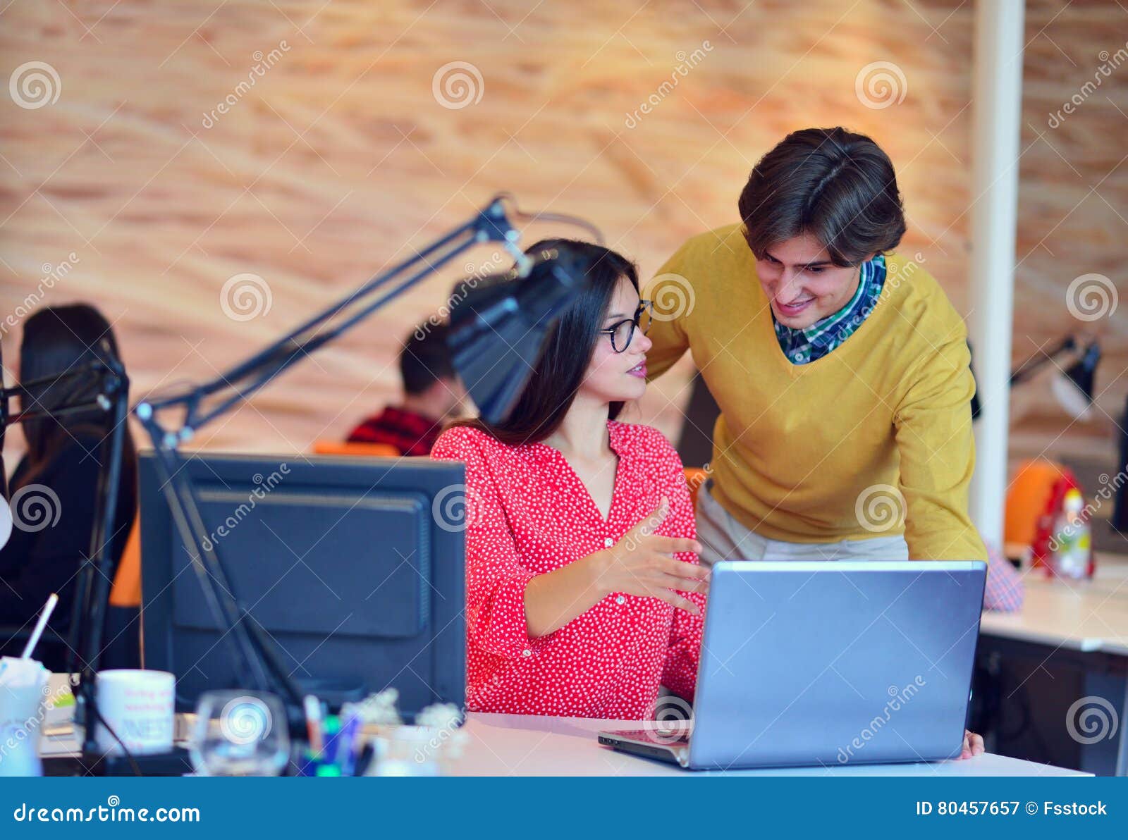 Business Couple Working Together on Project at Modern Startup Office ...