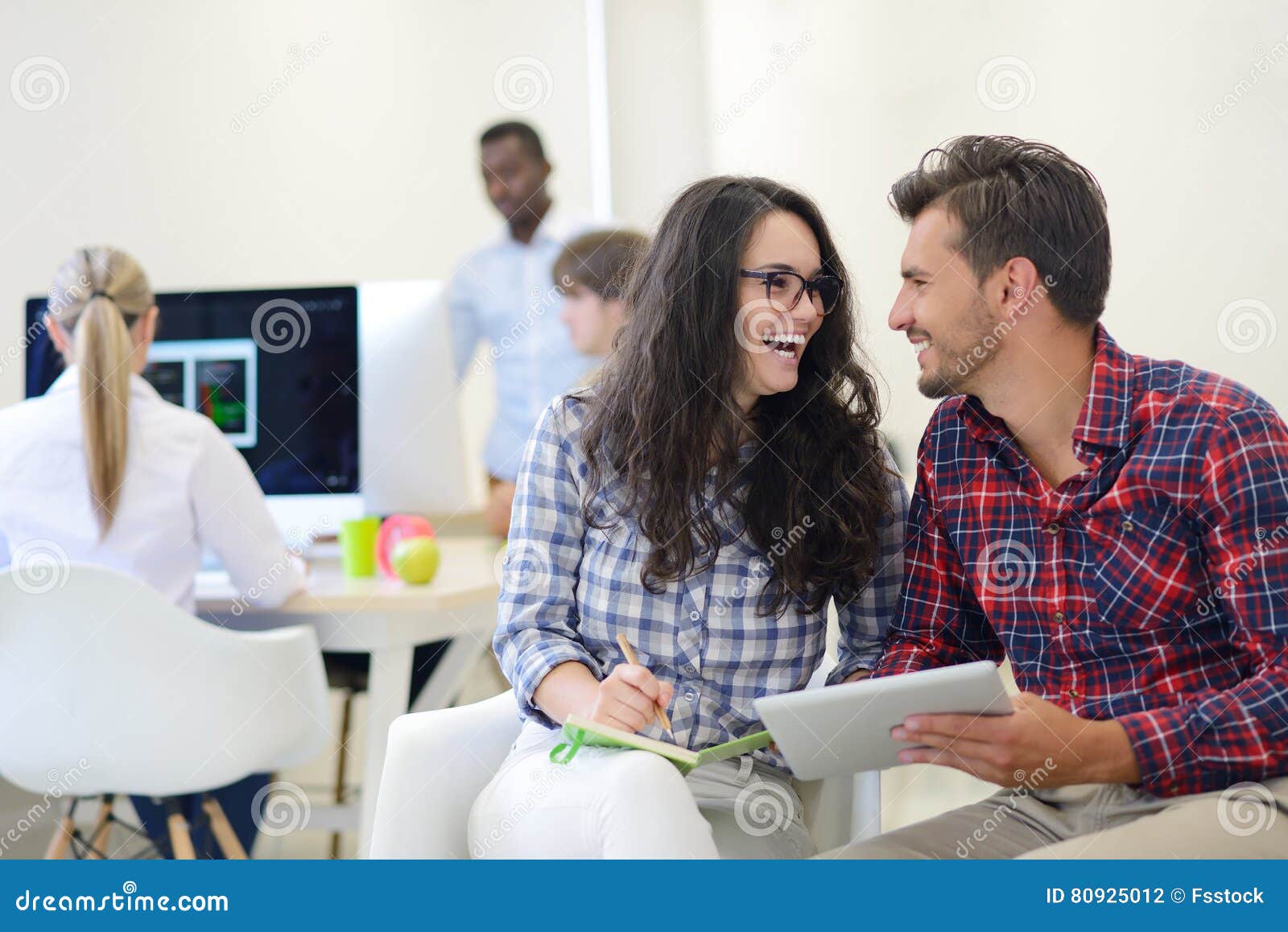 Business Couple Working Together on Project at Modern Startup Office ...